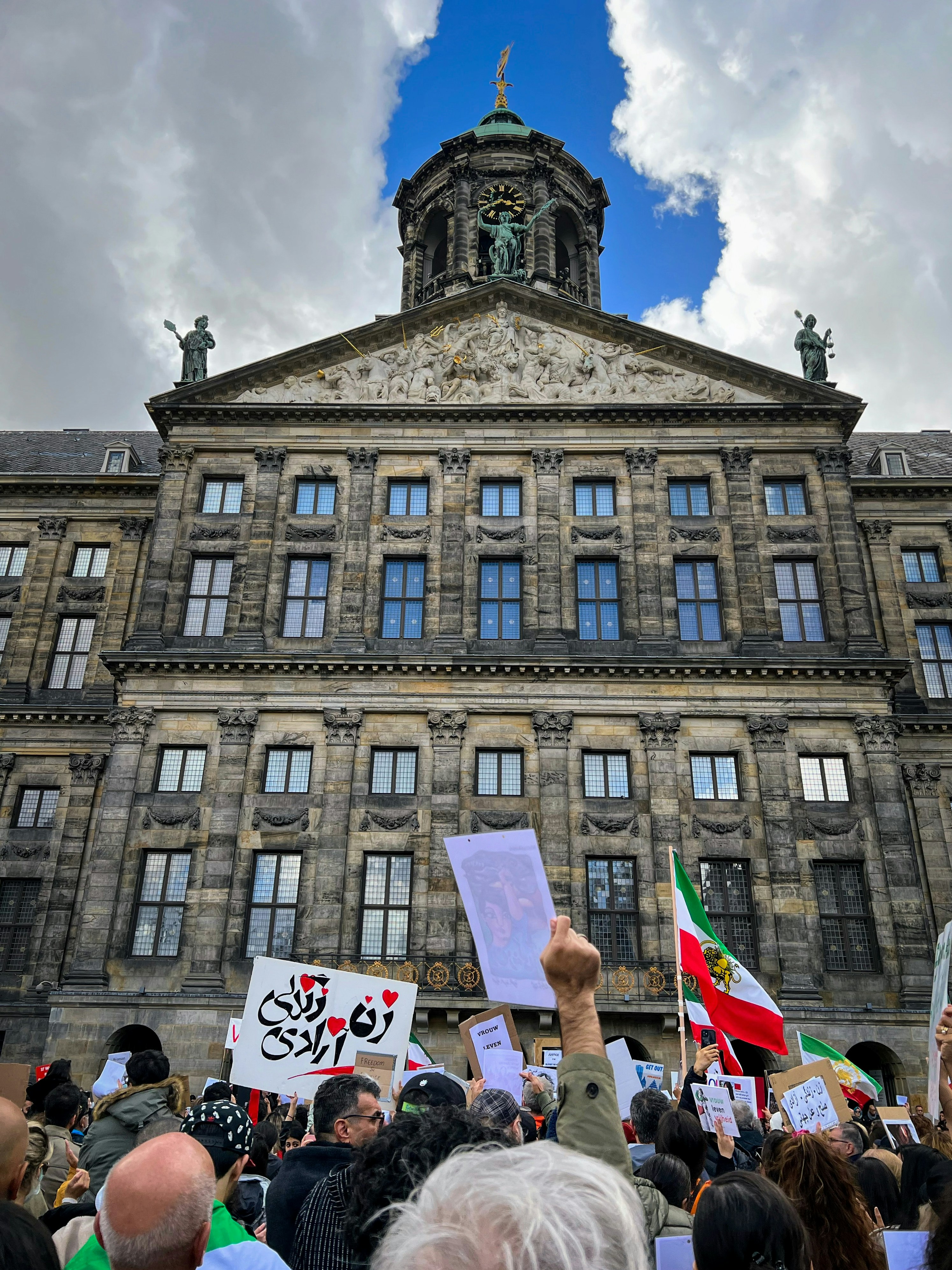 A crowd of people outside a building photo – Free Mahsa amini Image on ...