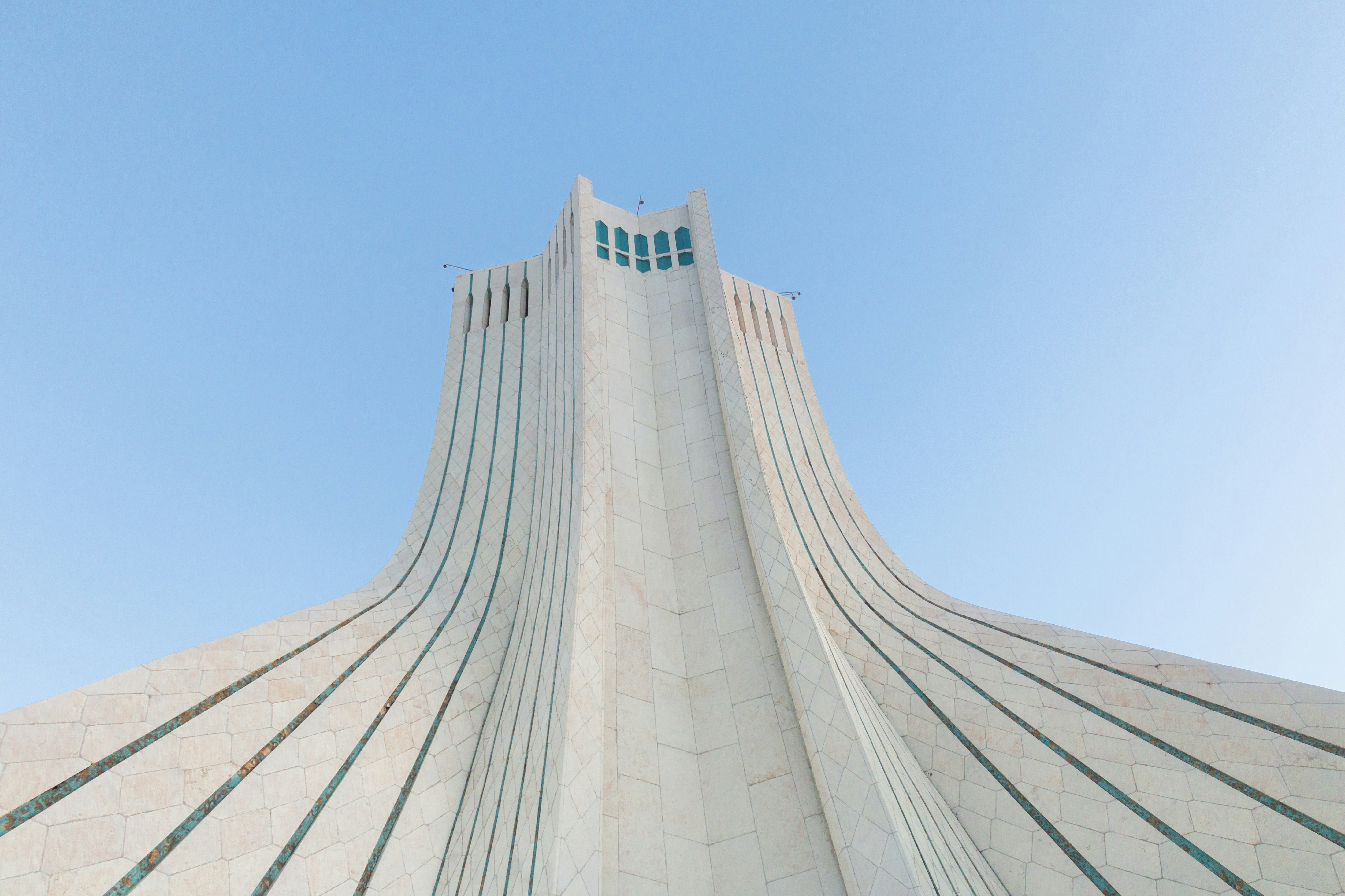 A tall white tower with Azadi Tower in the background photo – Free ...