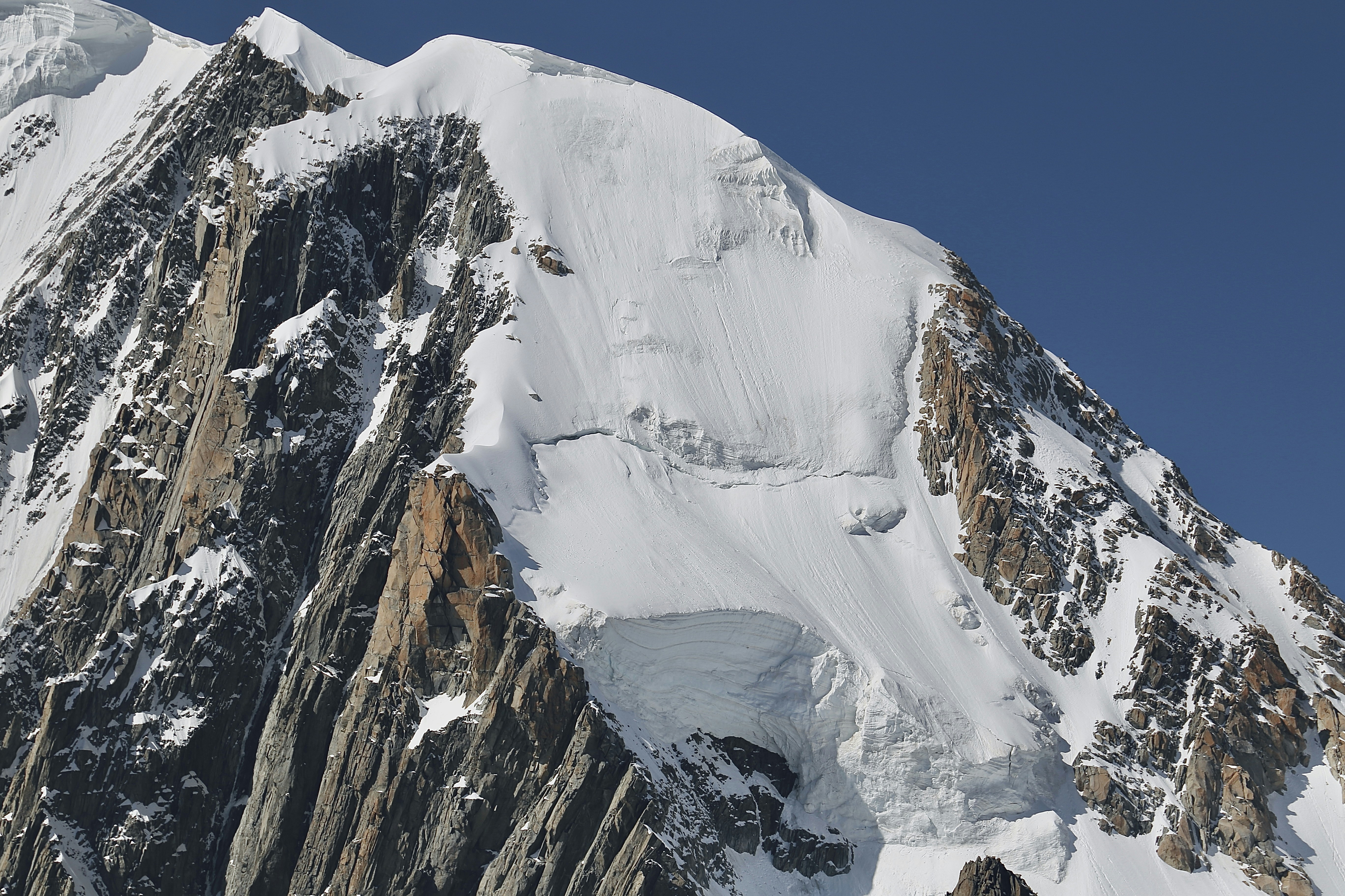 Snowbound Summit: A Razor-Edged Peak Reaches Toward a Clear Sky