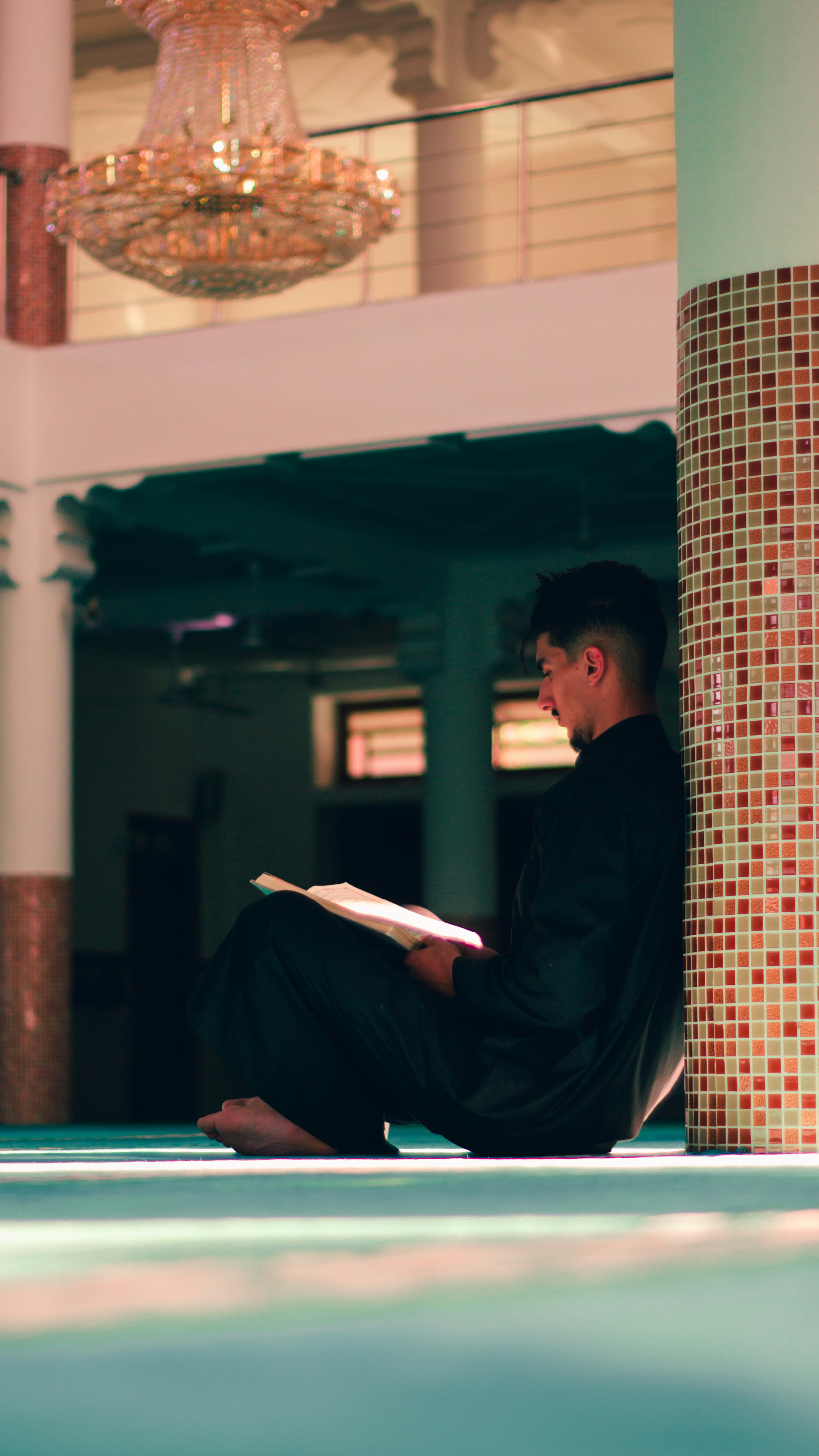 Quiet Focus Beneath Mosaic Pillars