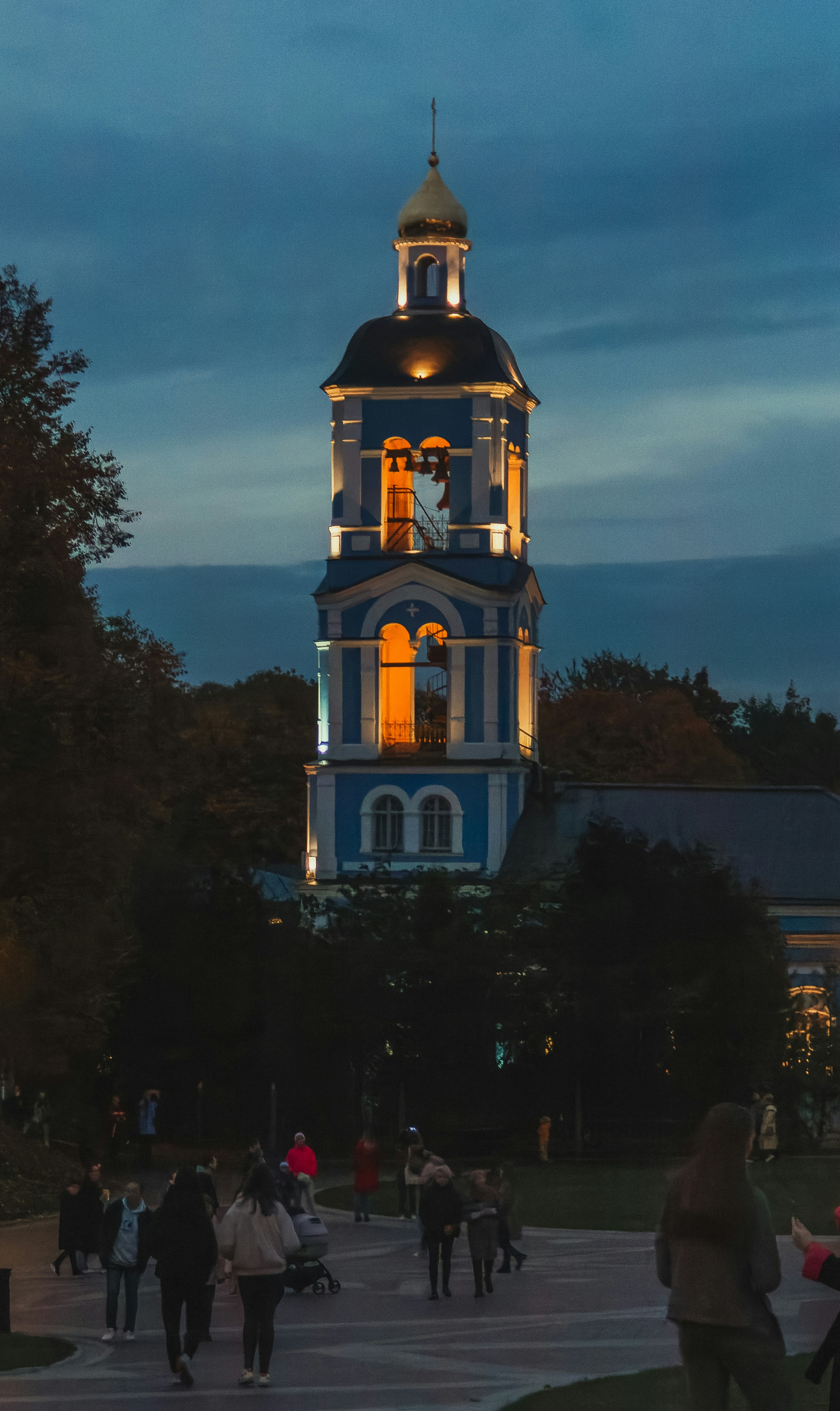 Dusk-Glow Bell Tower: Warm Windows Against a Blue Hour Facade