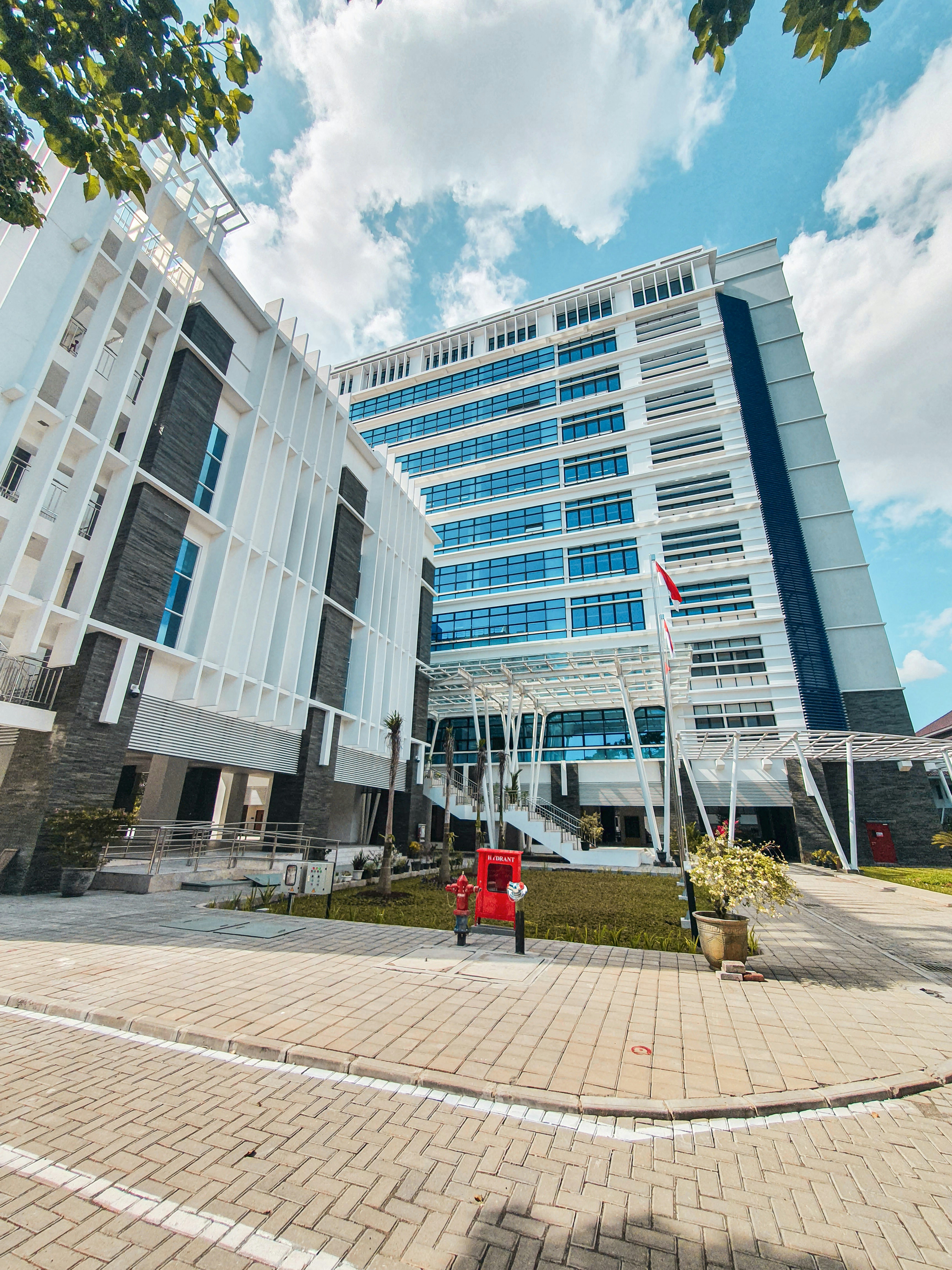A building with a brick walkway photo – Free Fakultas teknik ugm Image ...