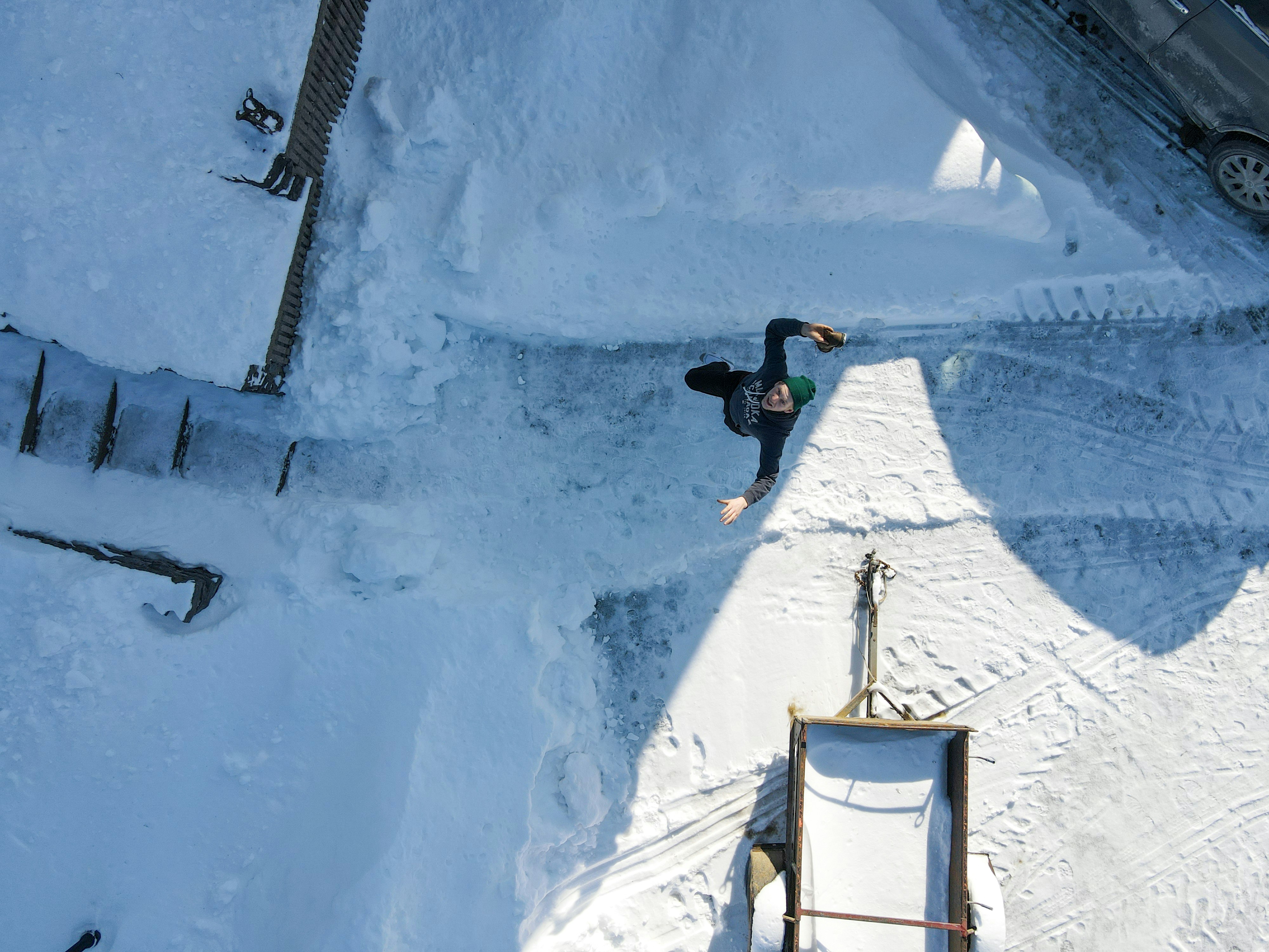 Arctic Leap under a Stark Shadow on Snow