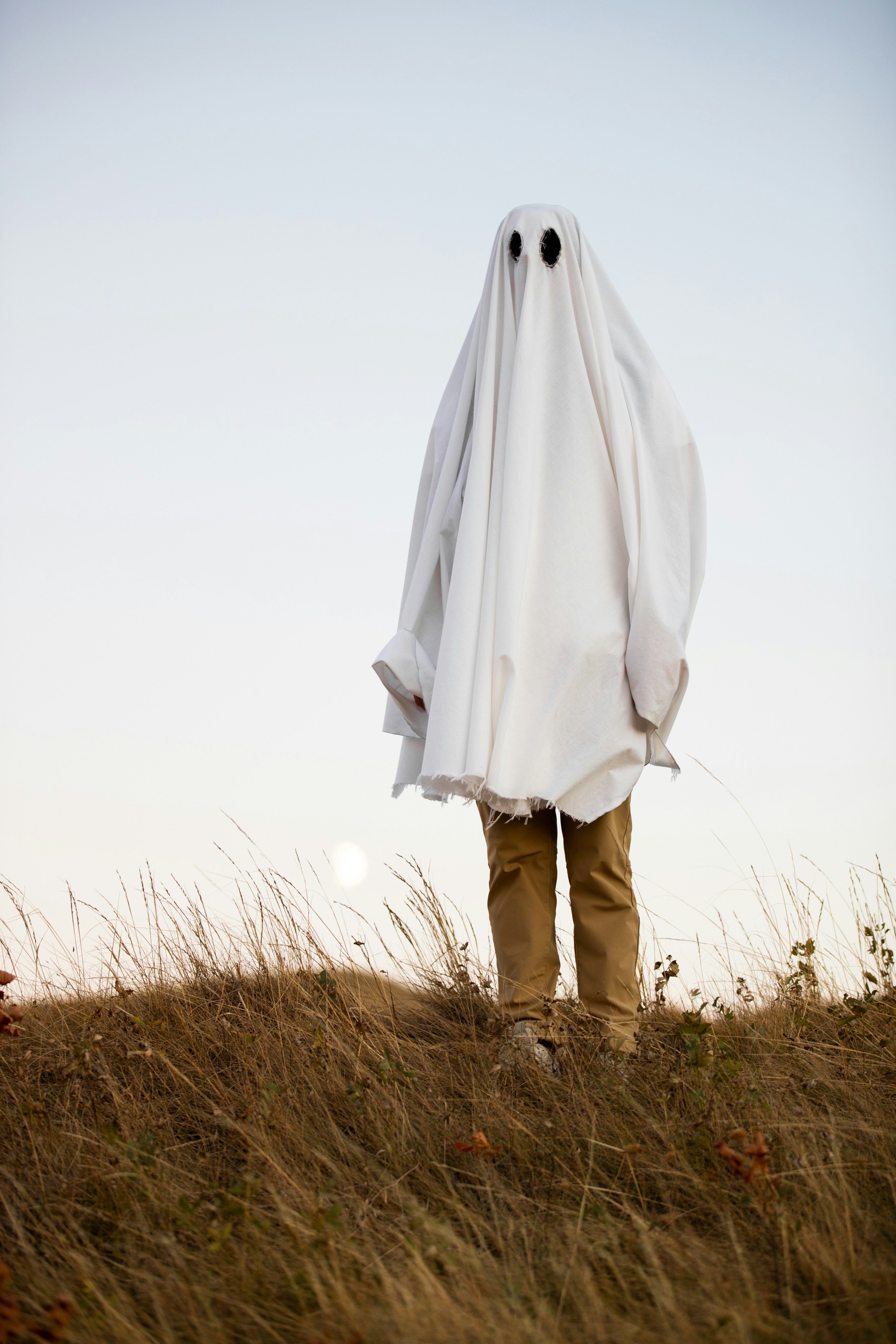 A person wearing a white sheet over their head photo – Free Canada ...