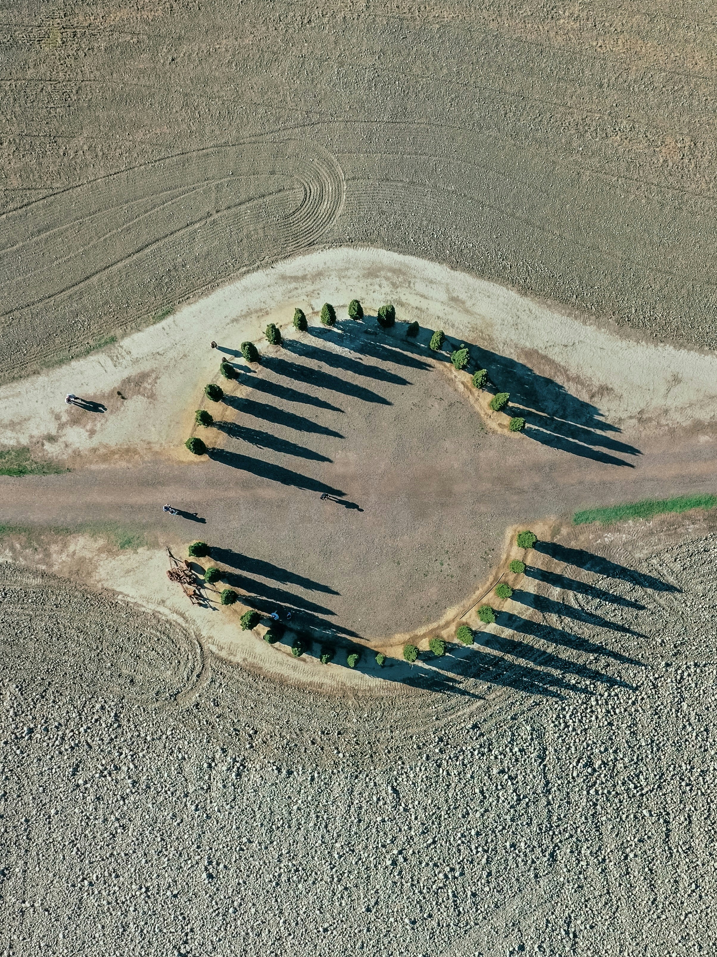 A large circular structure with people walking around it photo – Free ...