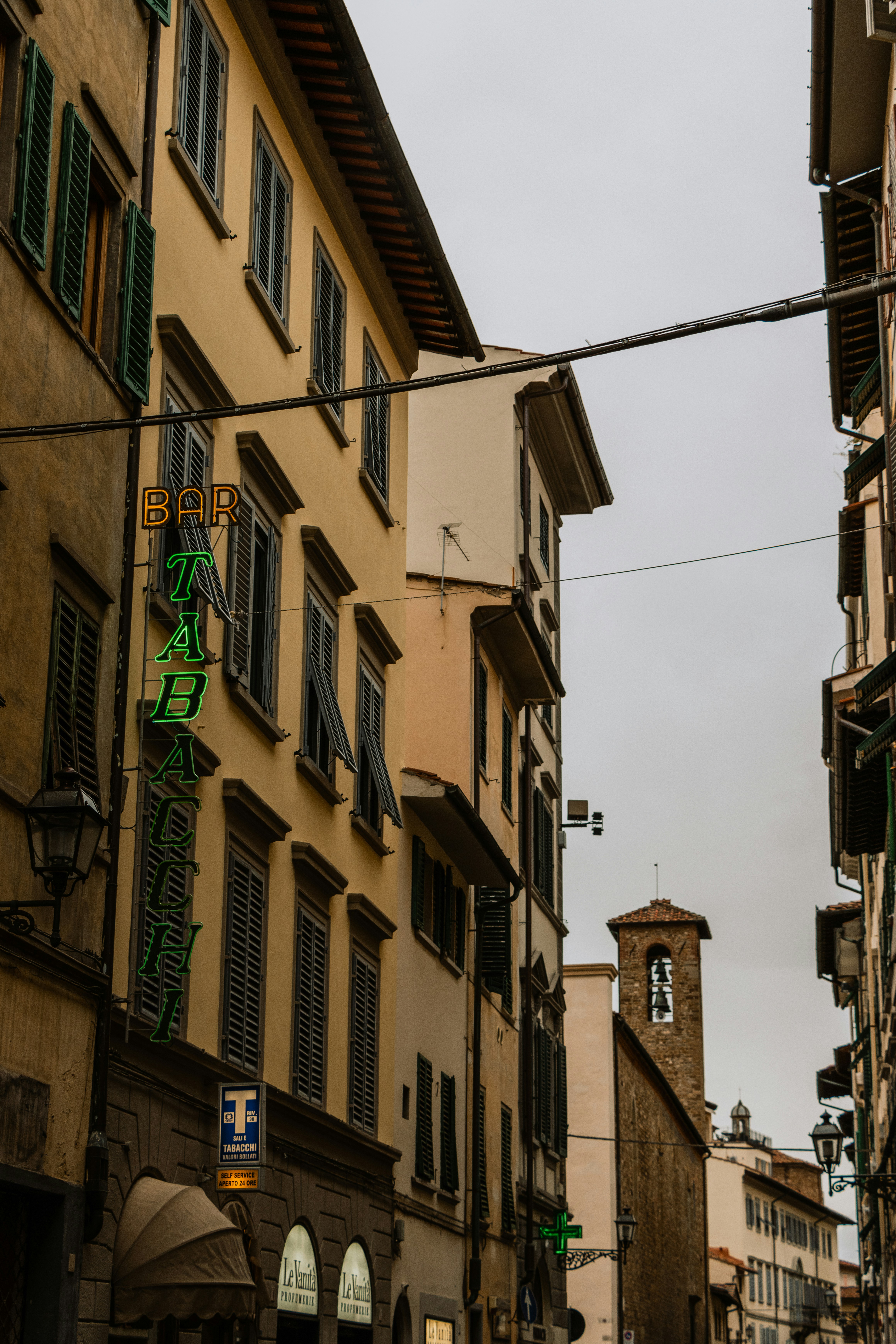 Neon Signage over a Narrow Italian Street