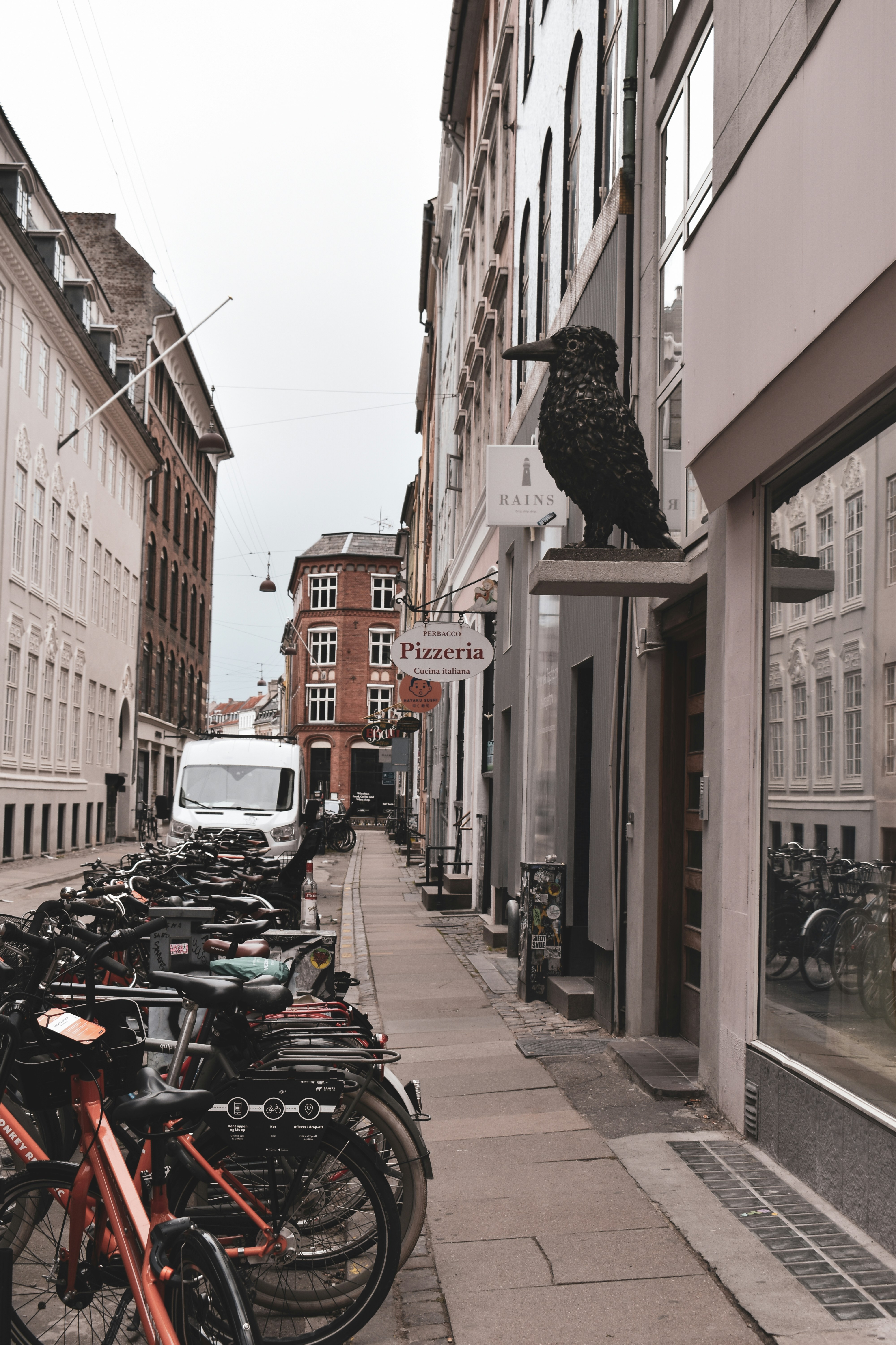 bicycles parked on the side of a street