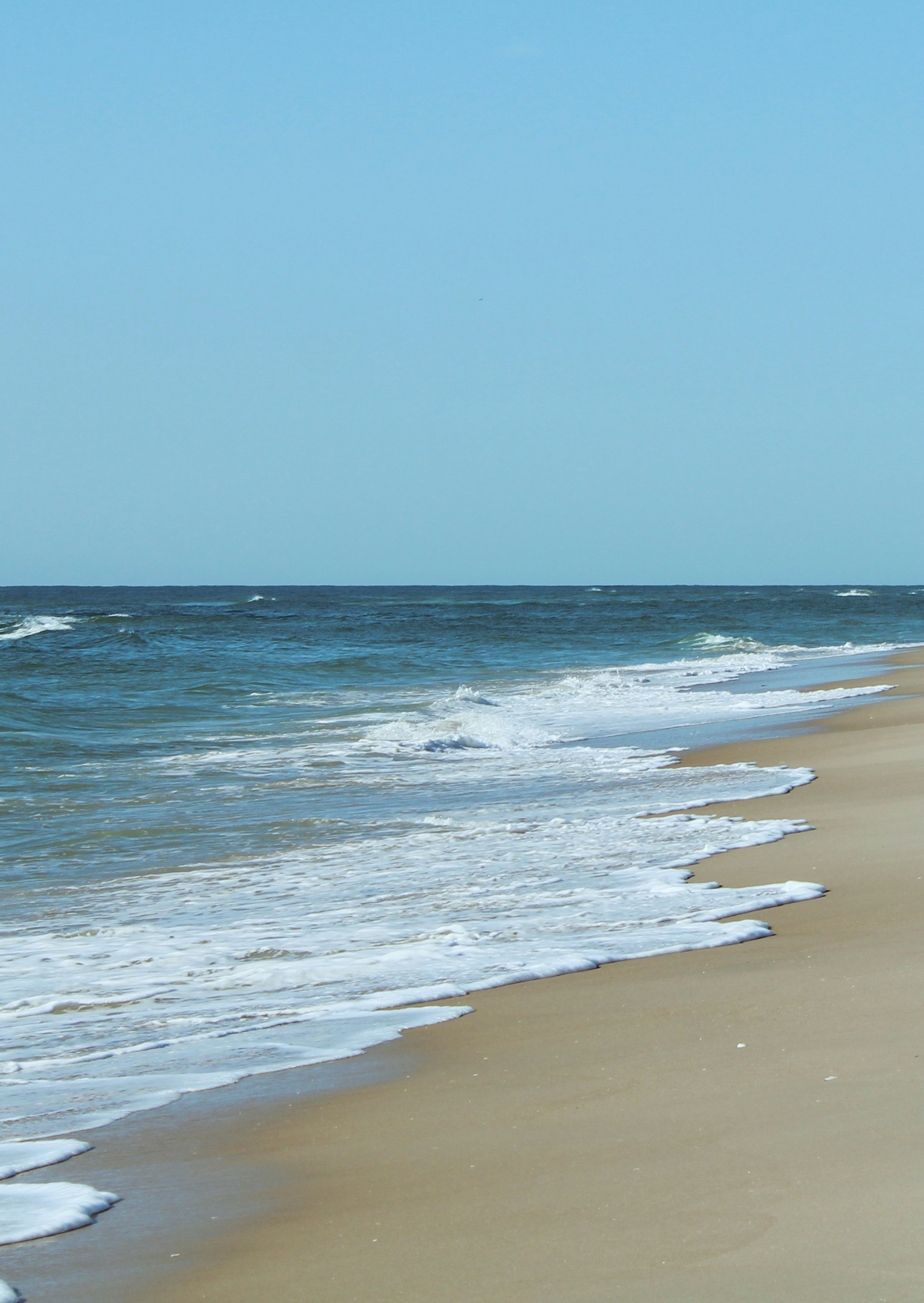 A beach with waves crashing on it photo – Free Assateague island Image ...