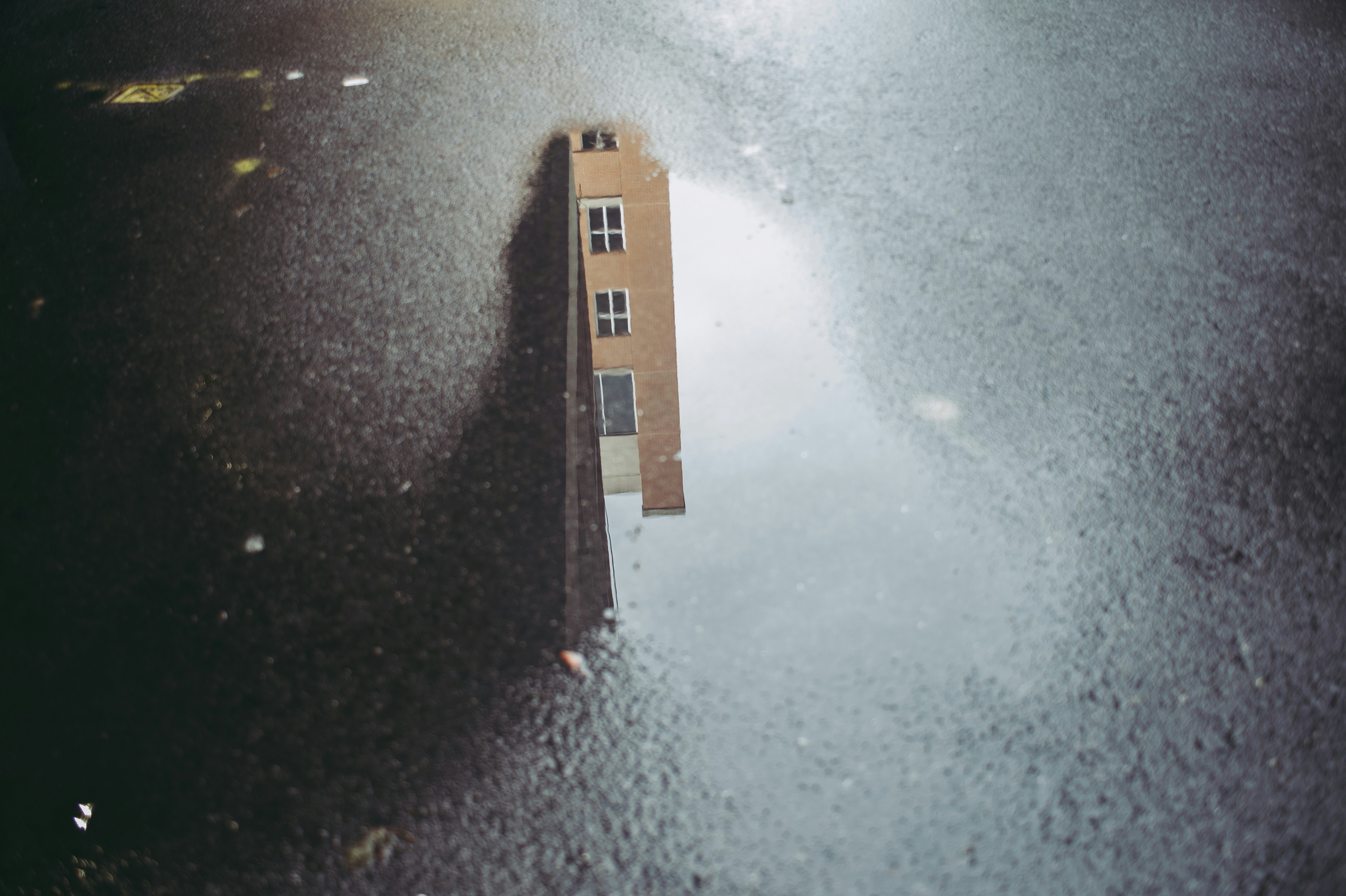 Urban Reflection: A Glimpse of Architecture Beneath the Surface