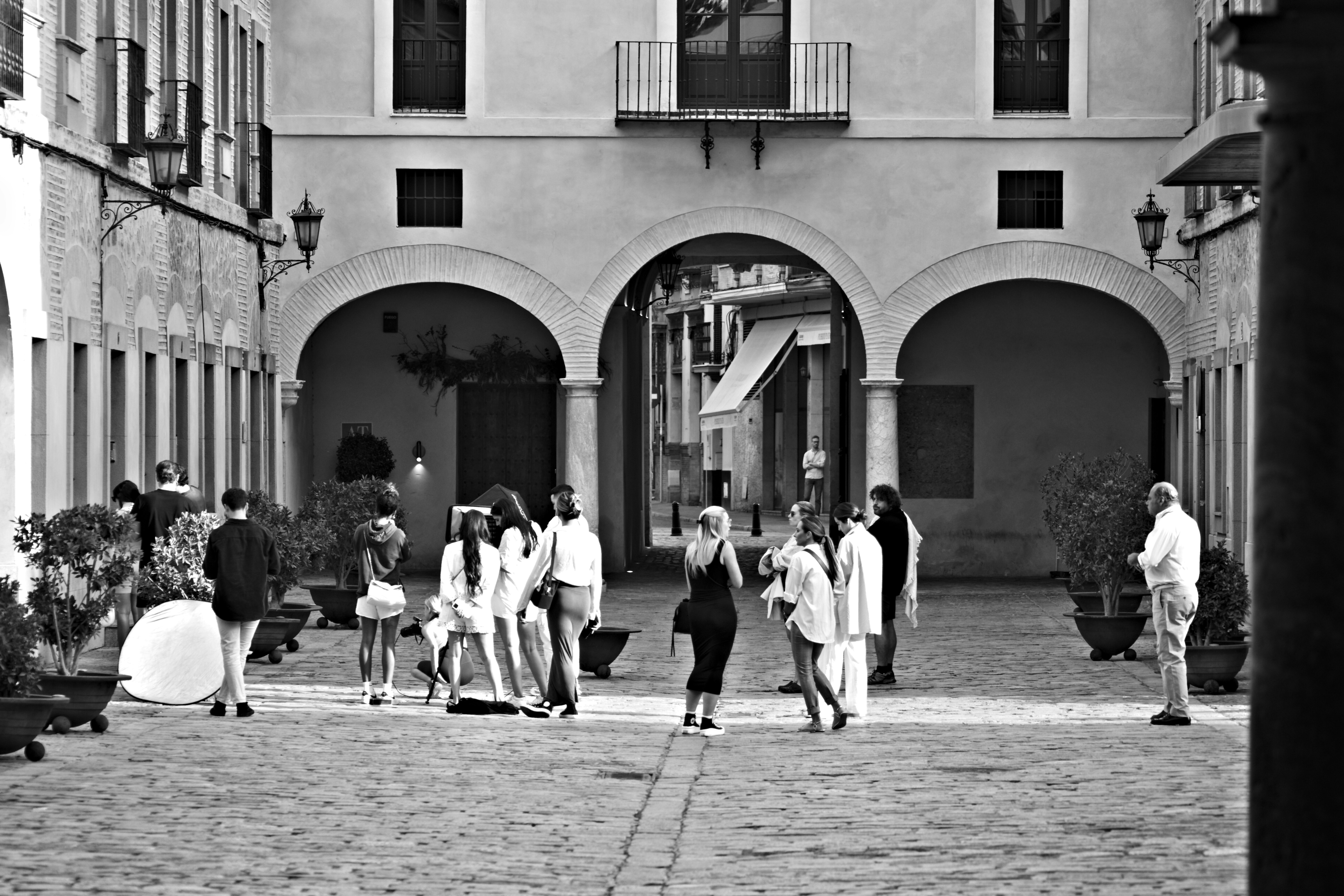 A group of people standing outside a building photo – Free Grey Image ...