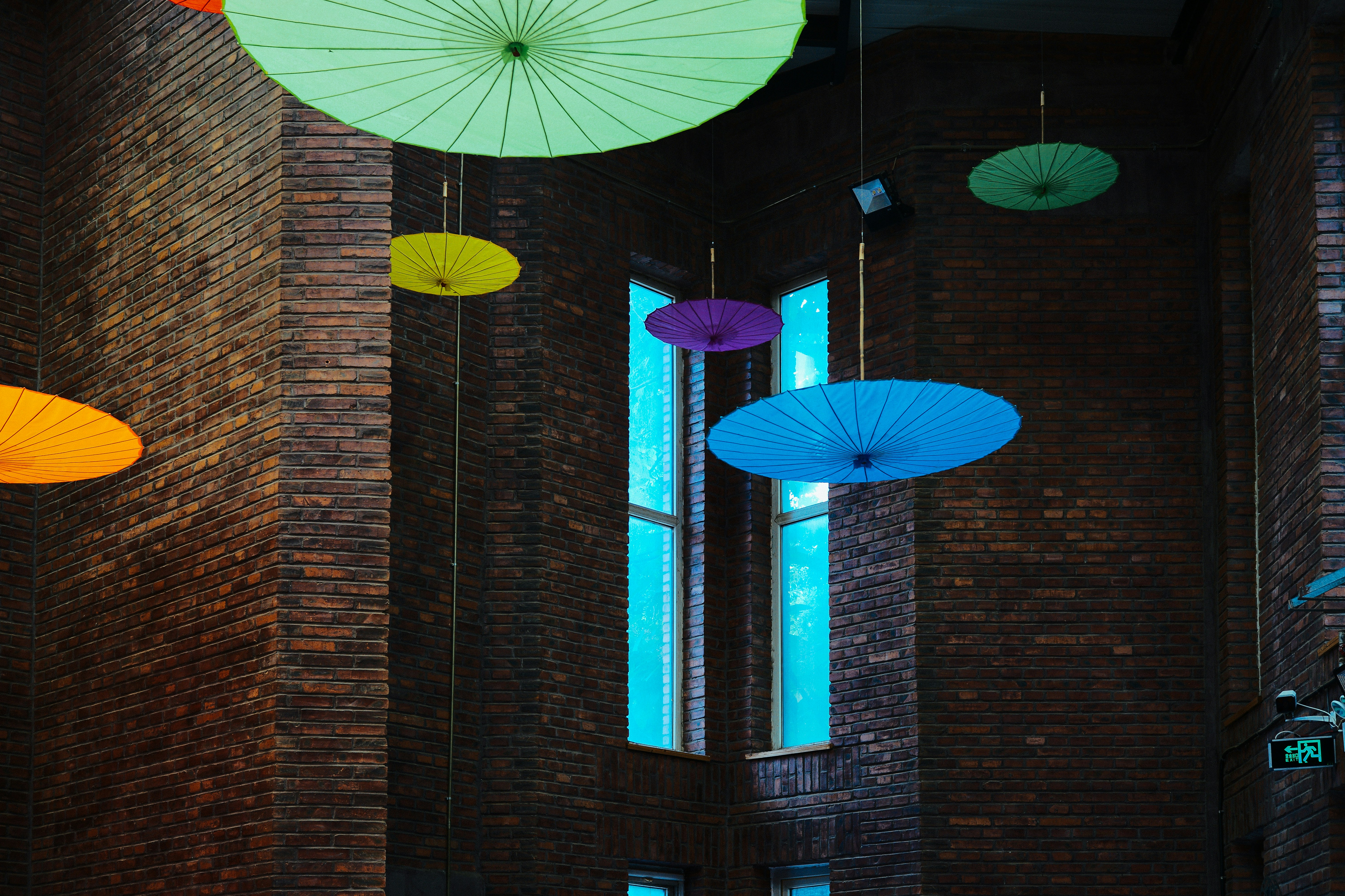 Umbrellas from a building photo – Free Blue Image on Unsplash