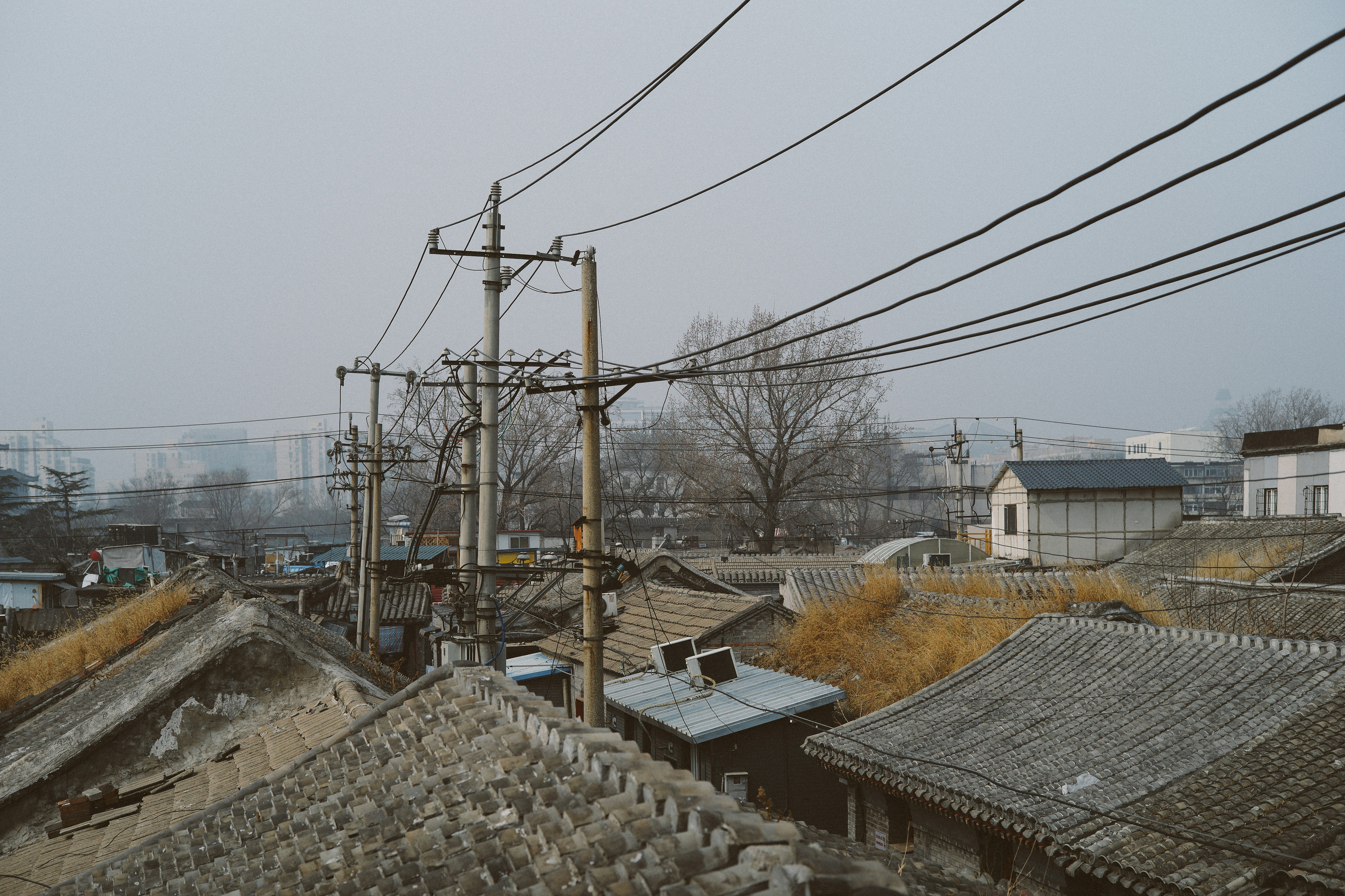 a group of houses with power lines
