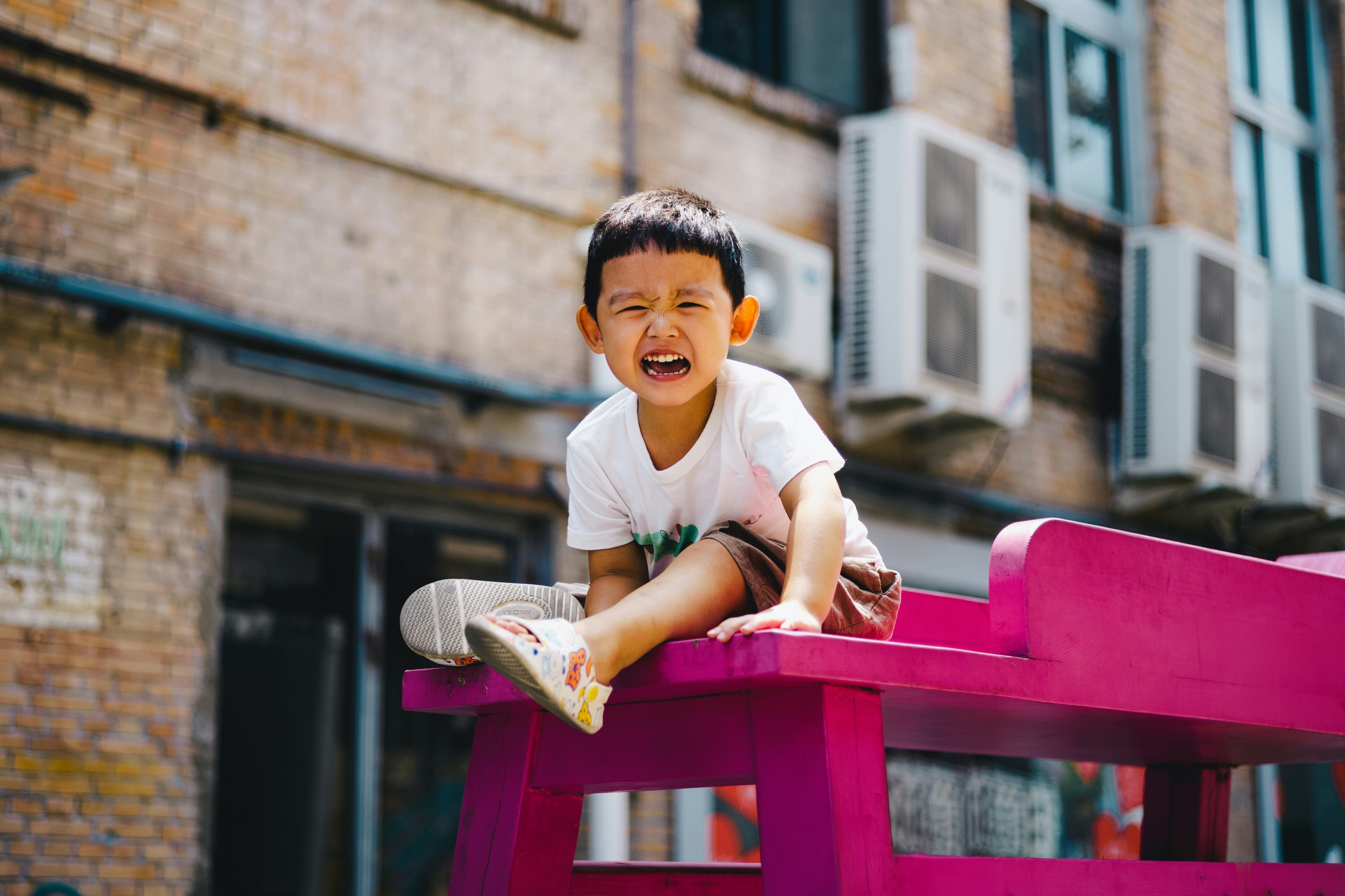 A child on a slide photo – Free Boy Image on Unsplash