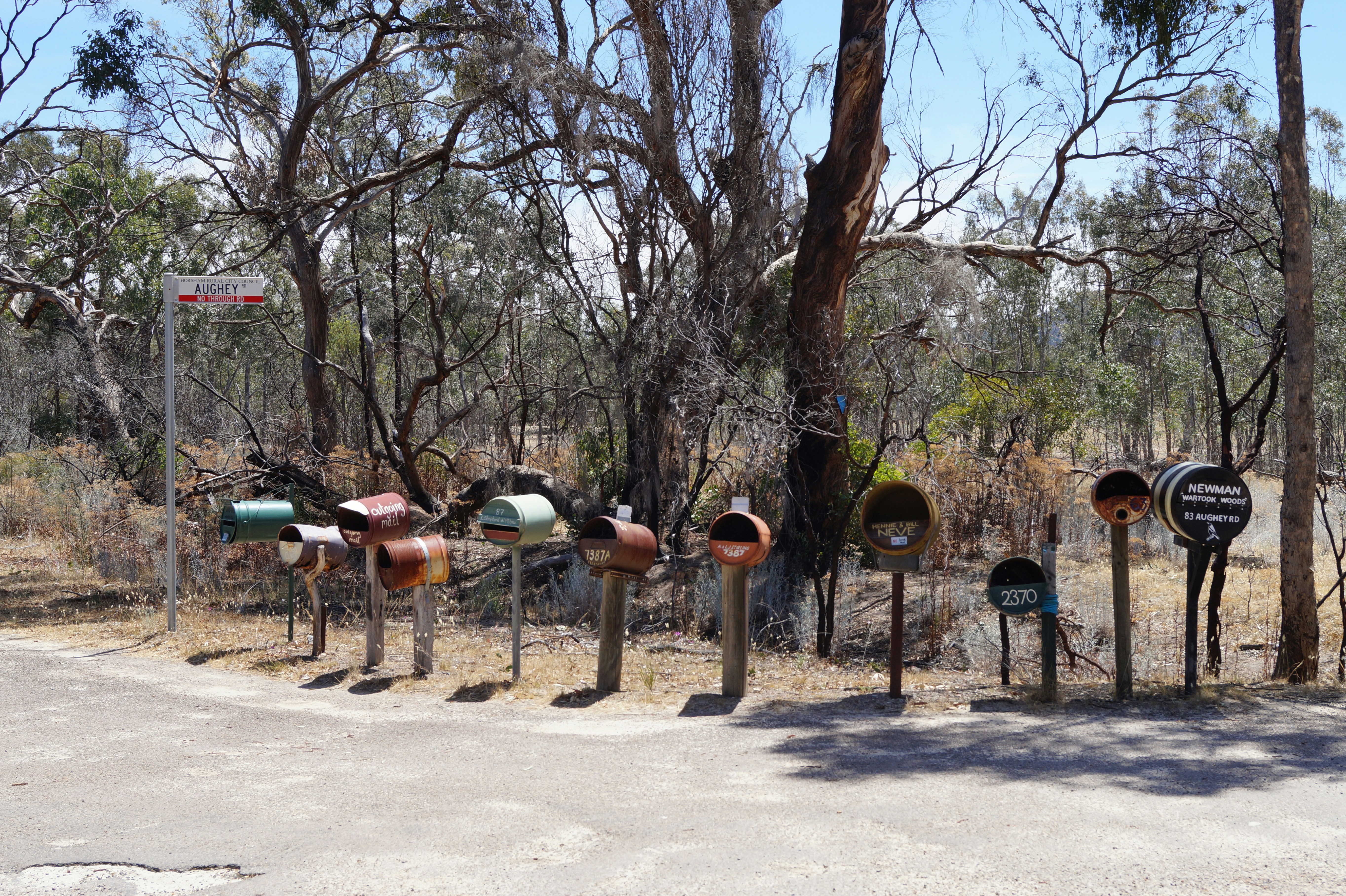A row of signs on a road photo – Free Grey Image on Unsplash