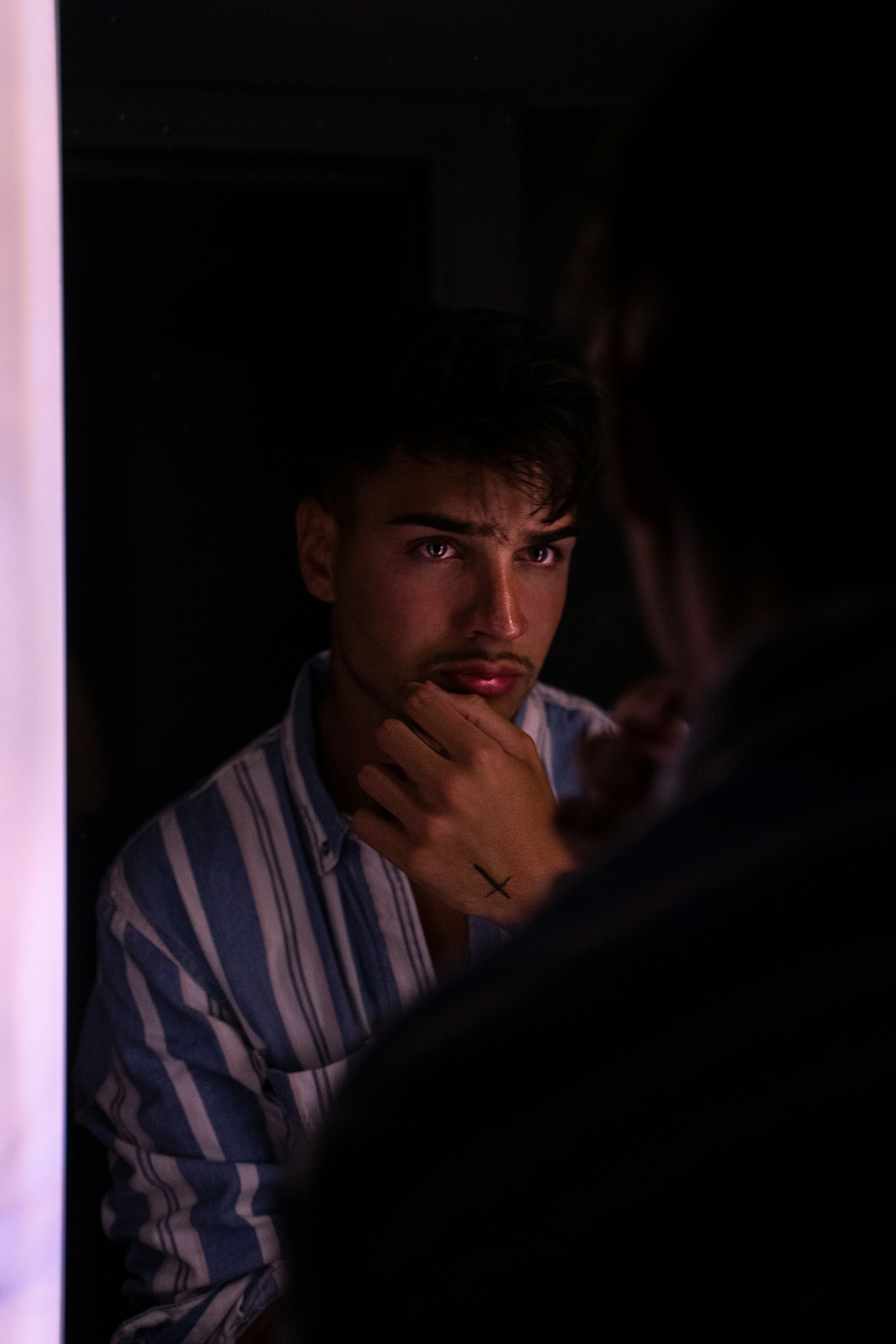 Midnight Reflection: A Gaze in Low Light