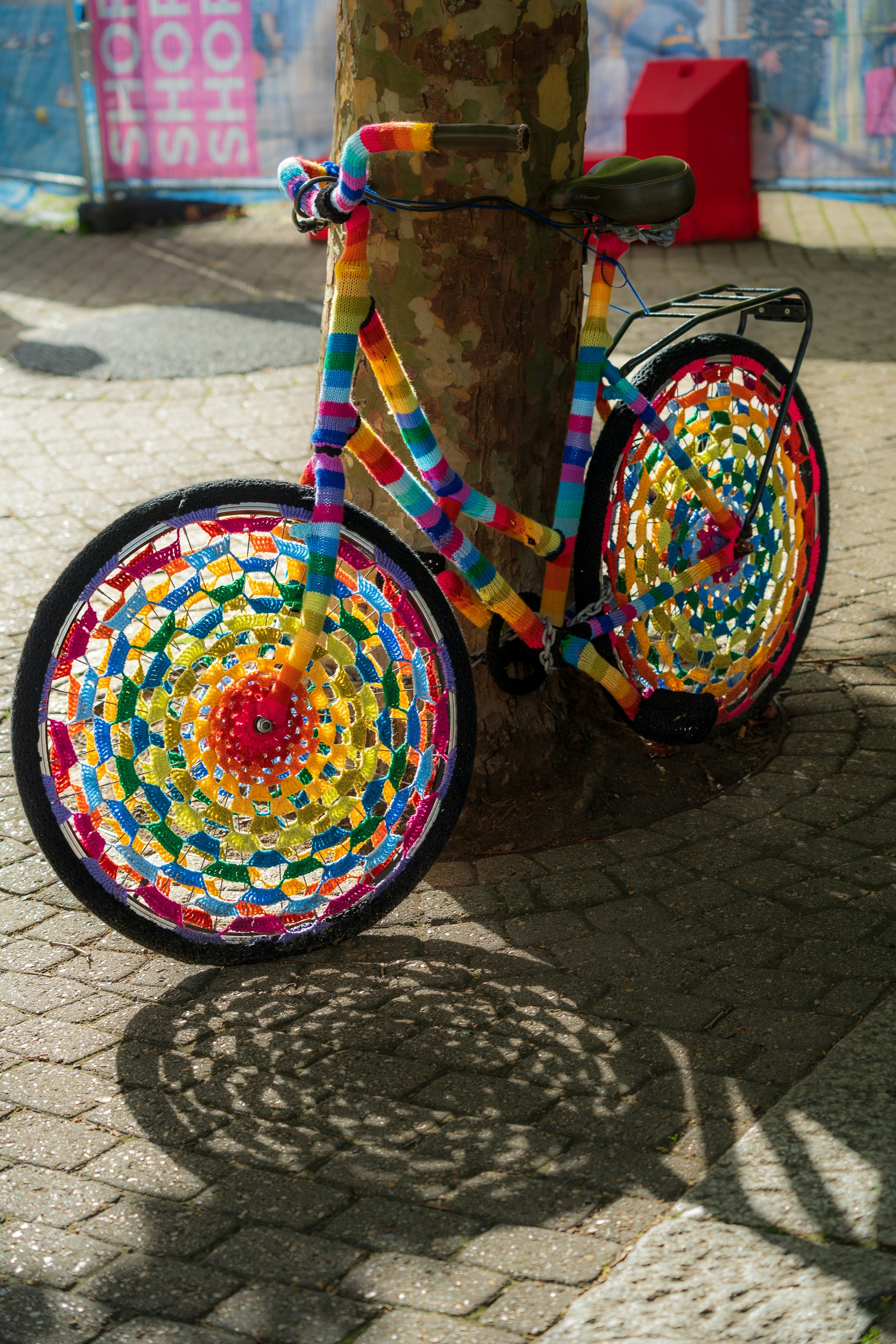 A bicycle covered in colourful crochet.