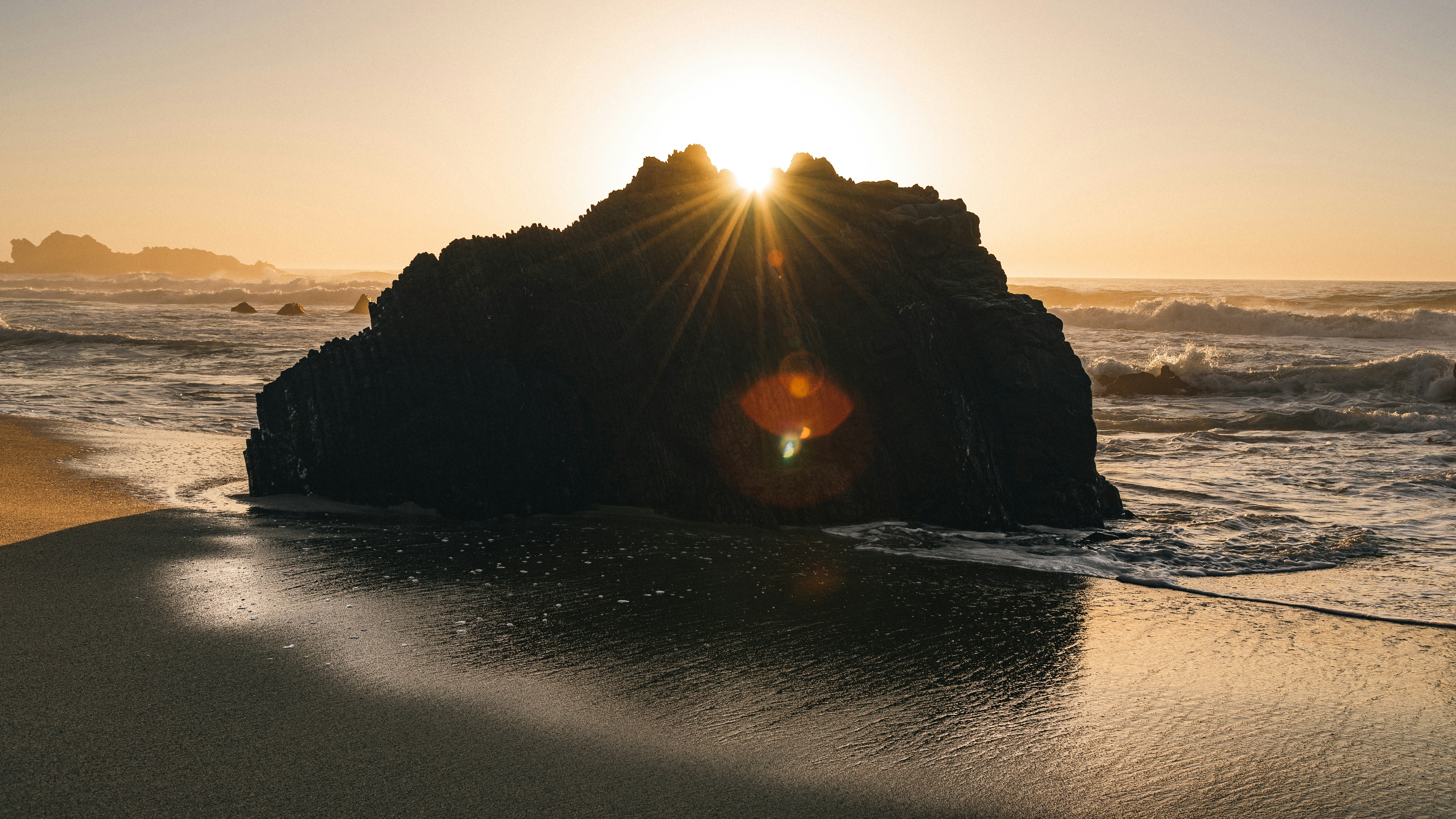 A rock on a beach photo – Free Black Image on Unsplash