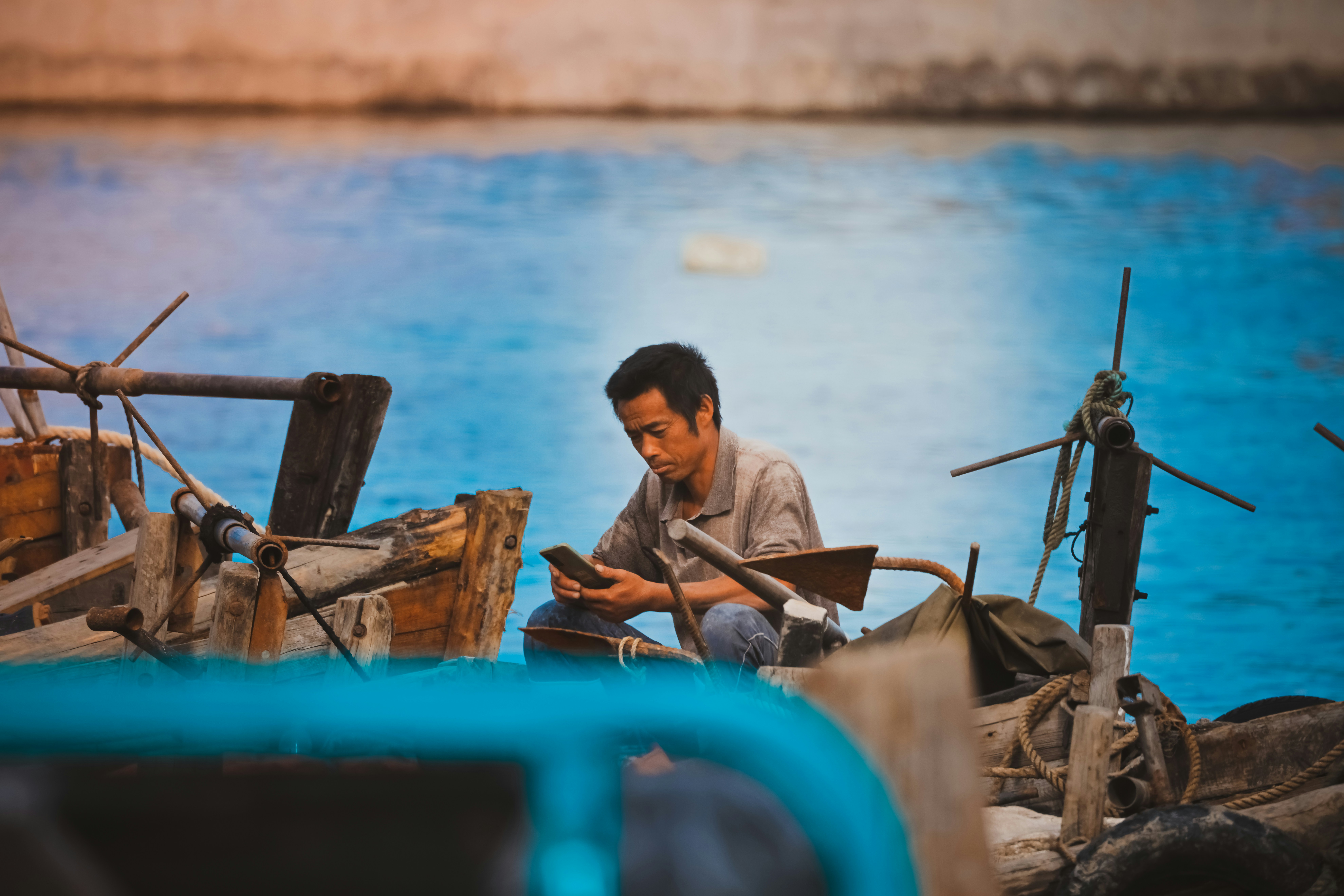 Lone Fisherman in the Blue Harbor Dawn