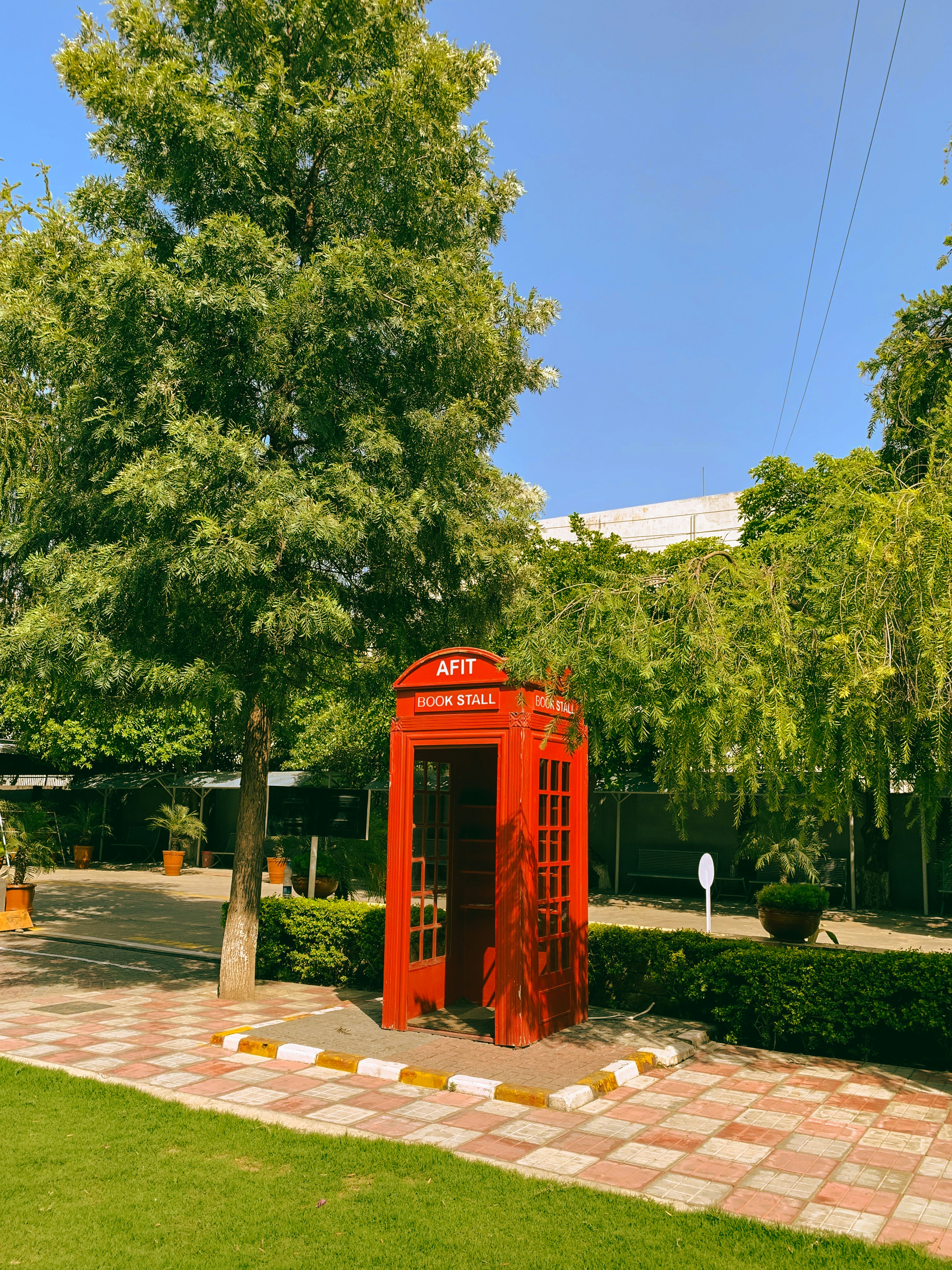 Red Kiosk in a Calm Courtyard