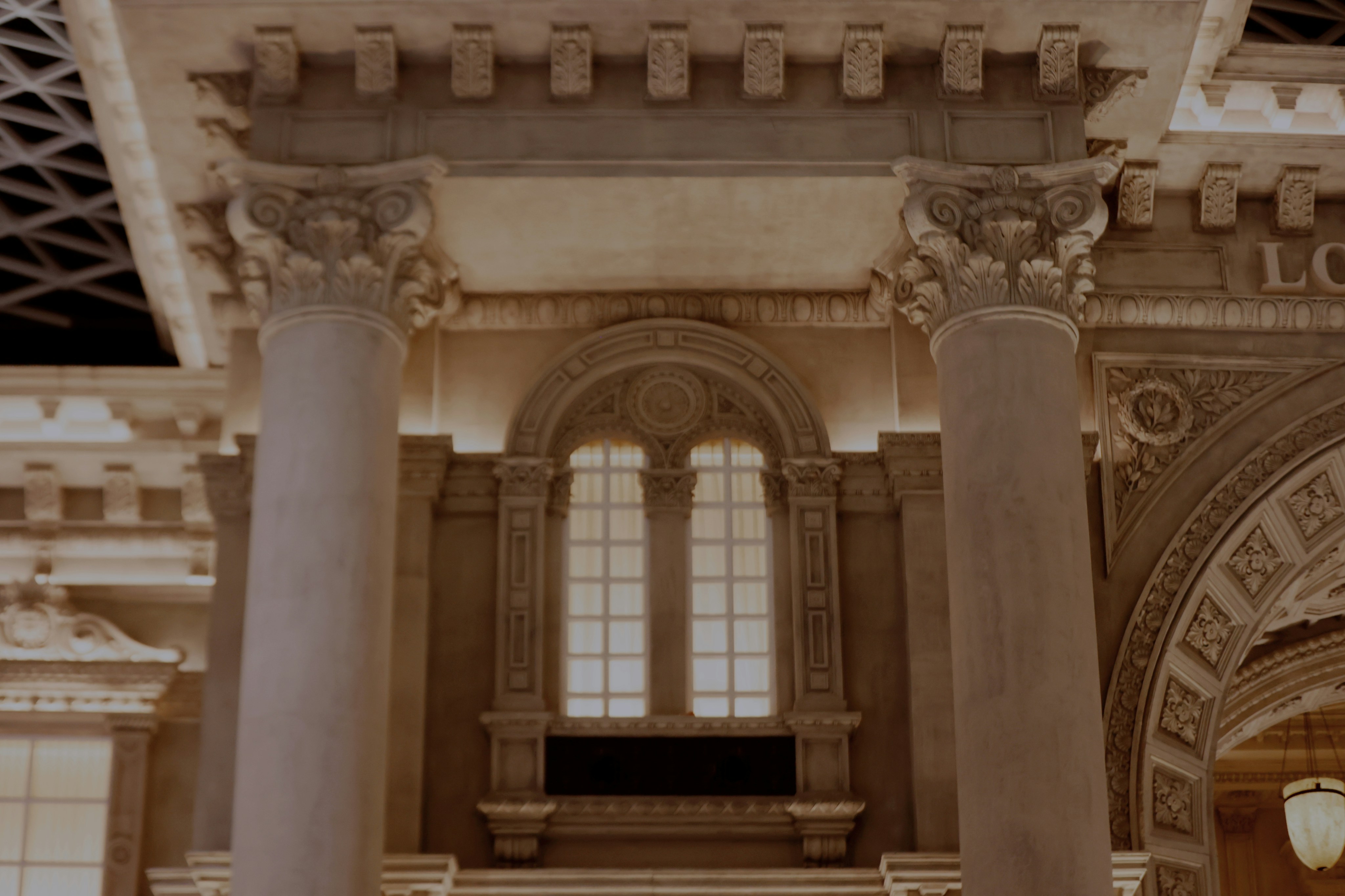 A building with pillars and a large window photo – Free Building Image ...