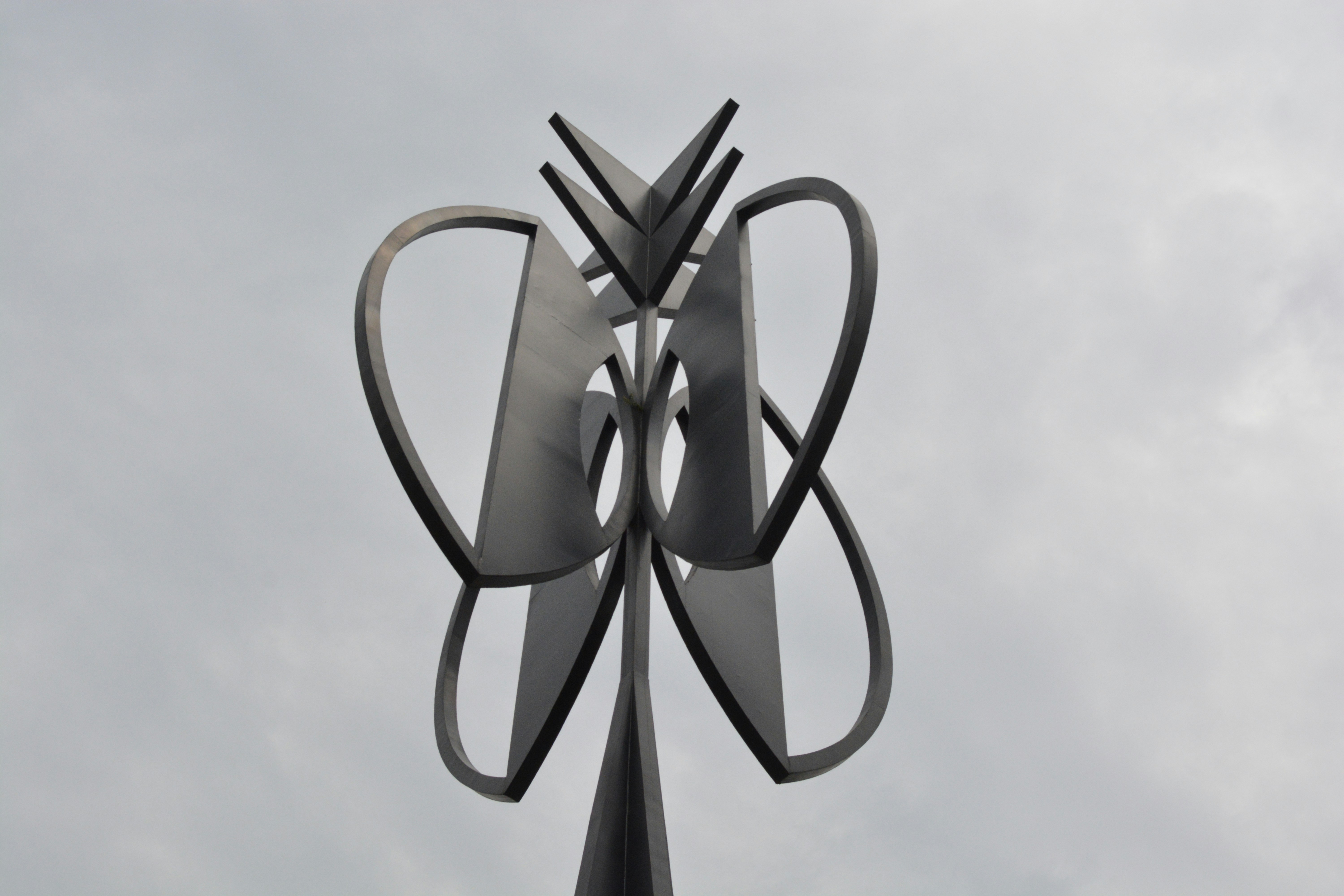 Steel Petals Against the Sky: A Looping Monolith