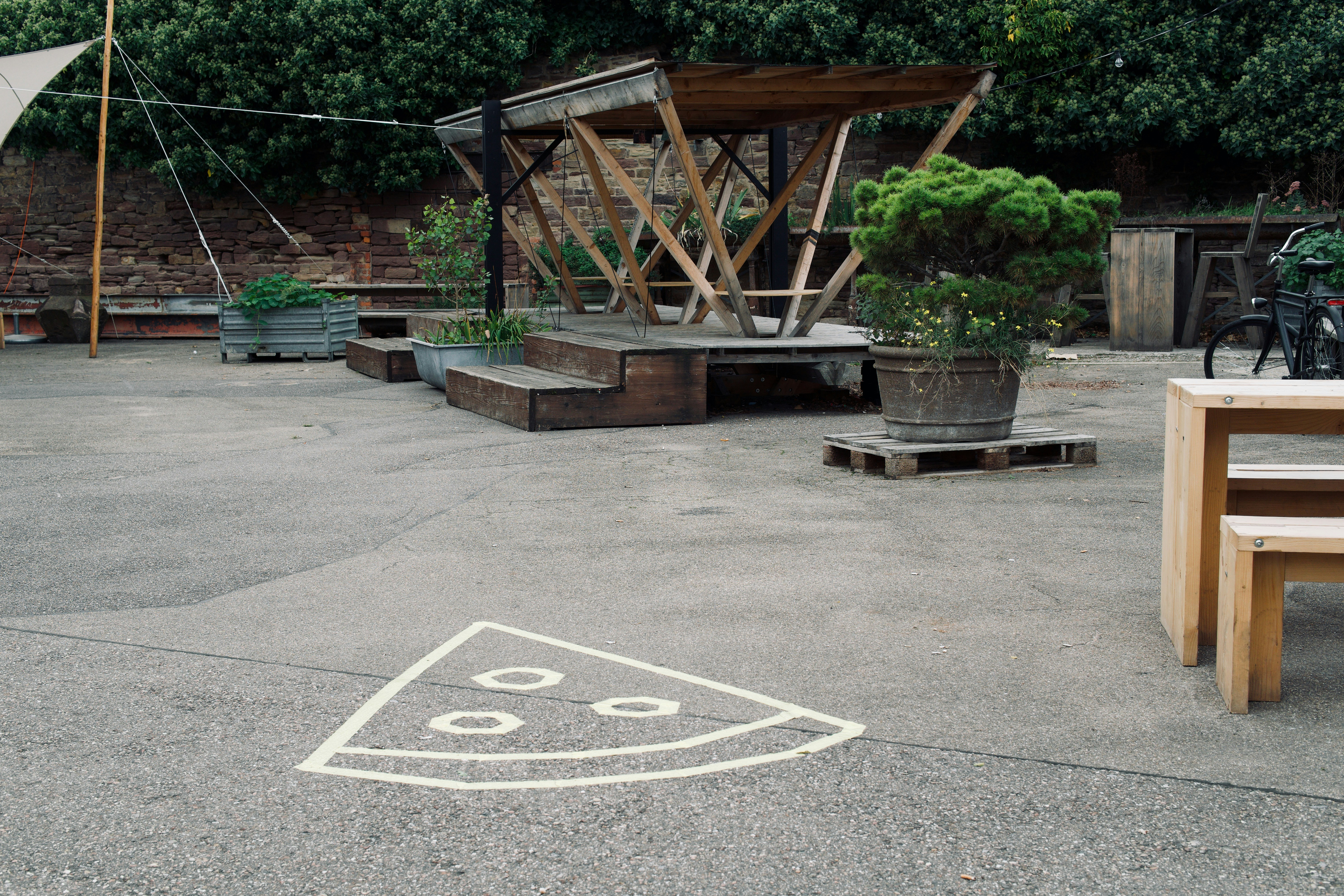 Chalk Pizza Slice Anchored in a Quiet Courtyard