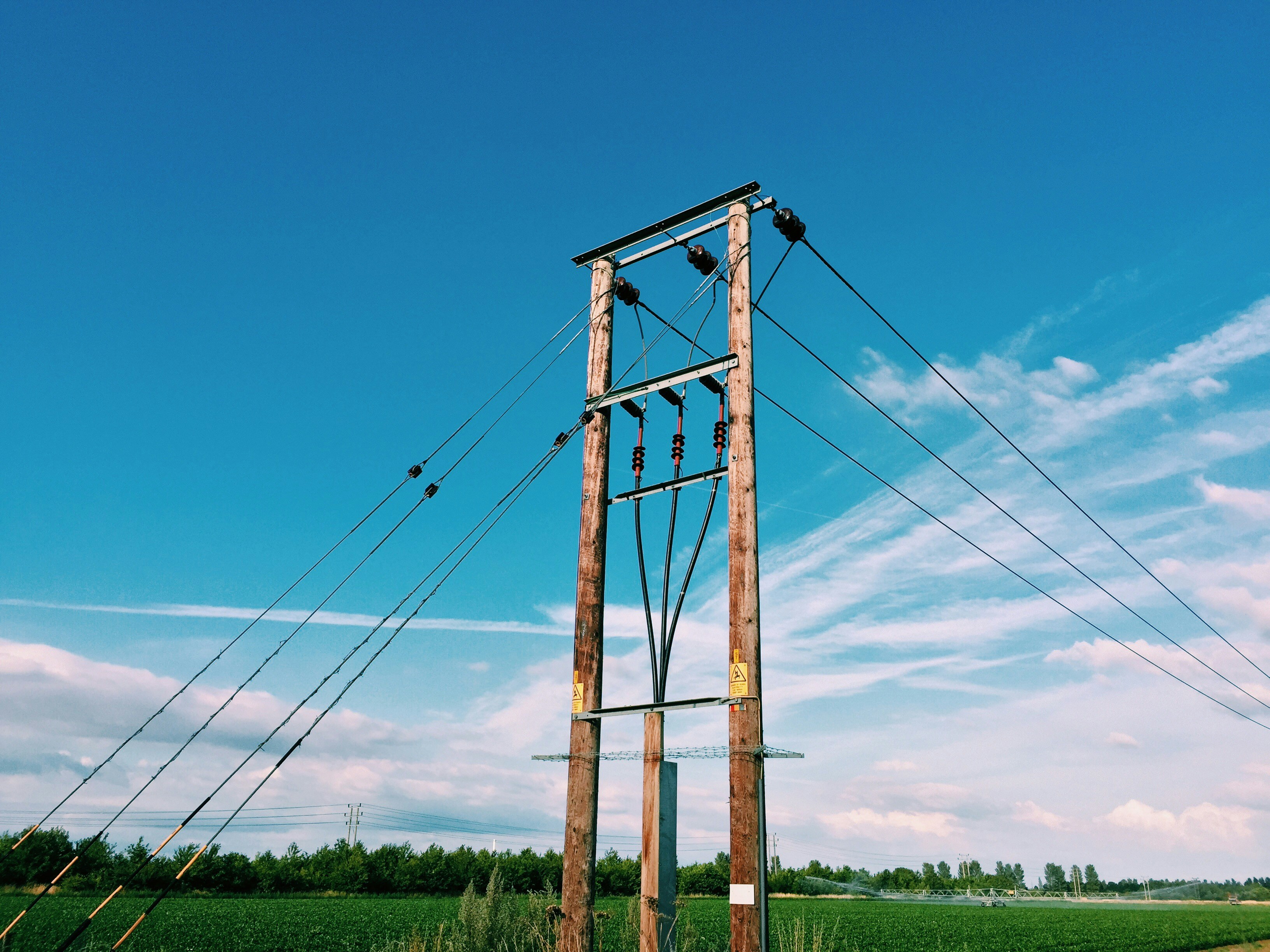 Lines of Power Reaching Toward a Blue Horizon
