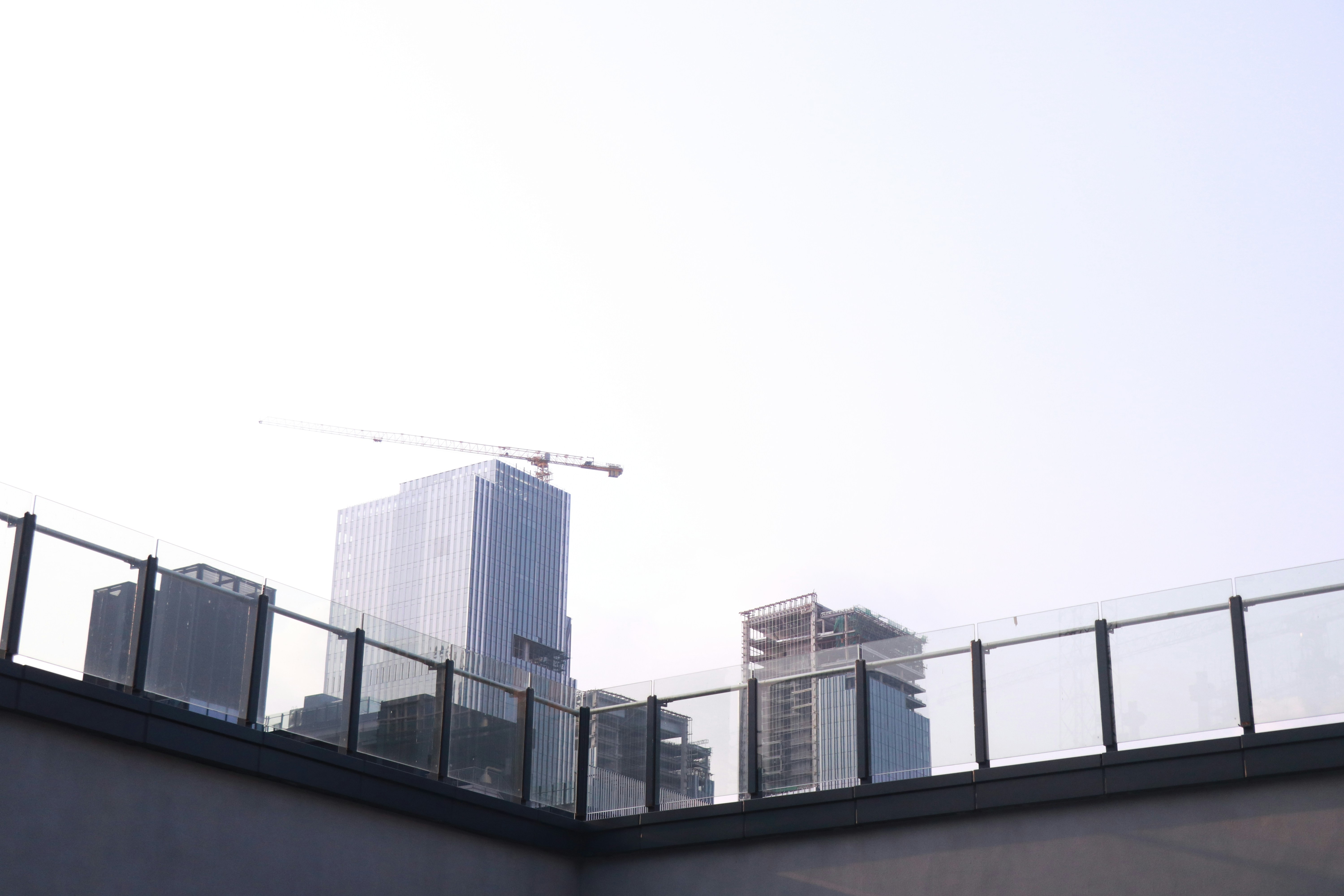 A crane on top of a building photo – Free Shenzhen Image on Unsplash