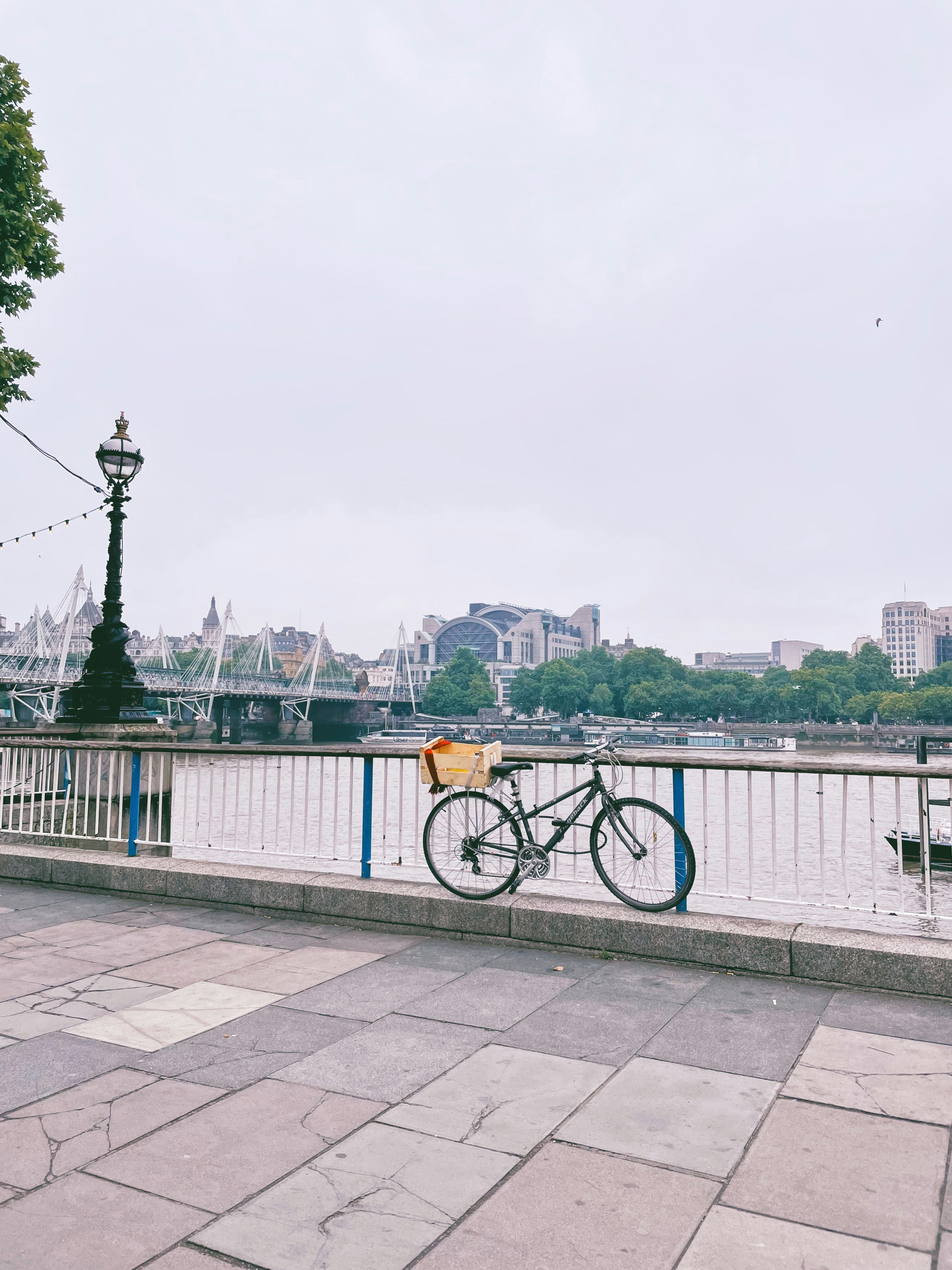 a bicycle parked on a bridge