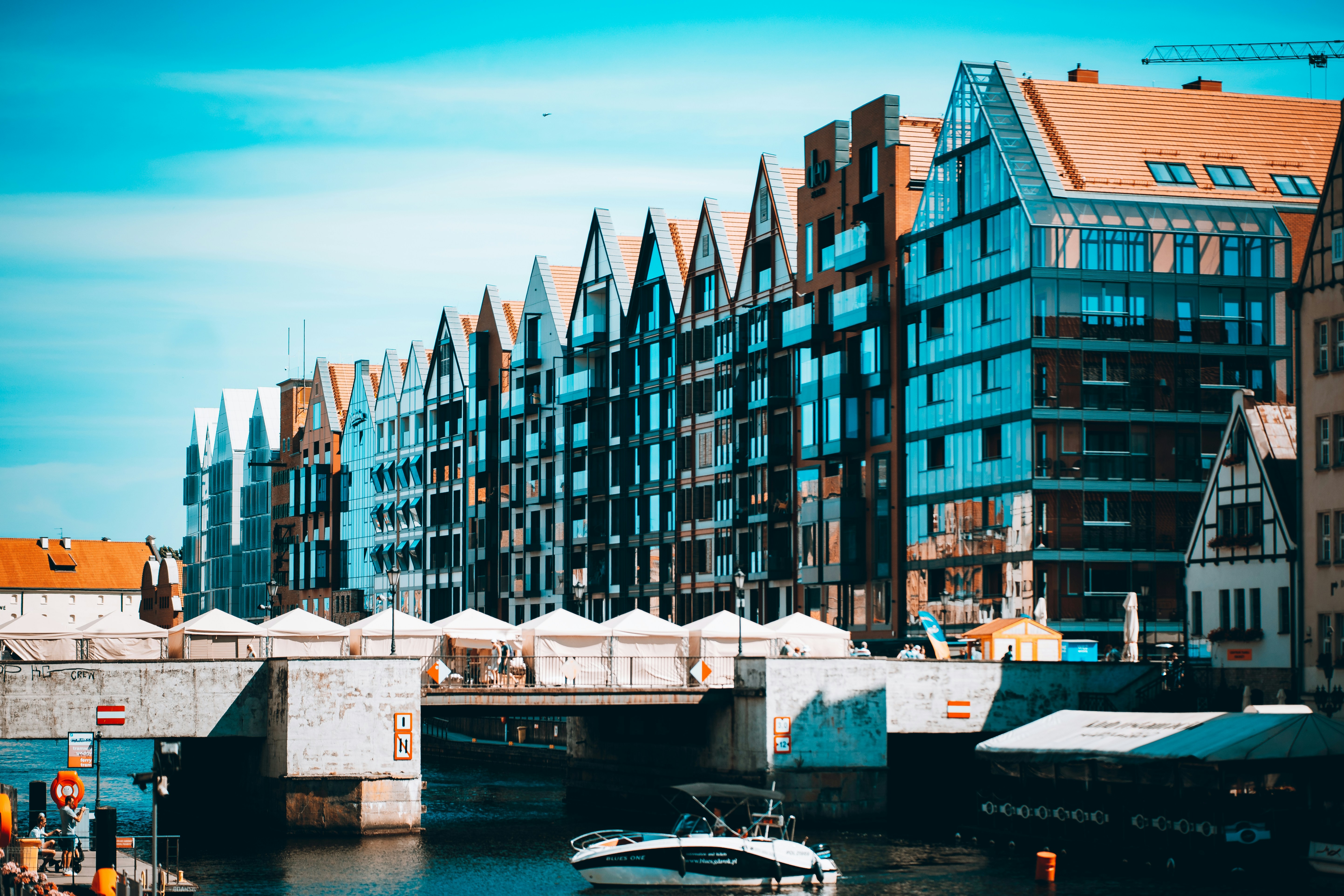 Gabled Glassfronts Along a Turquoise Riverside