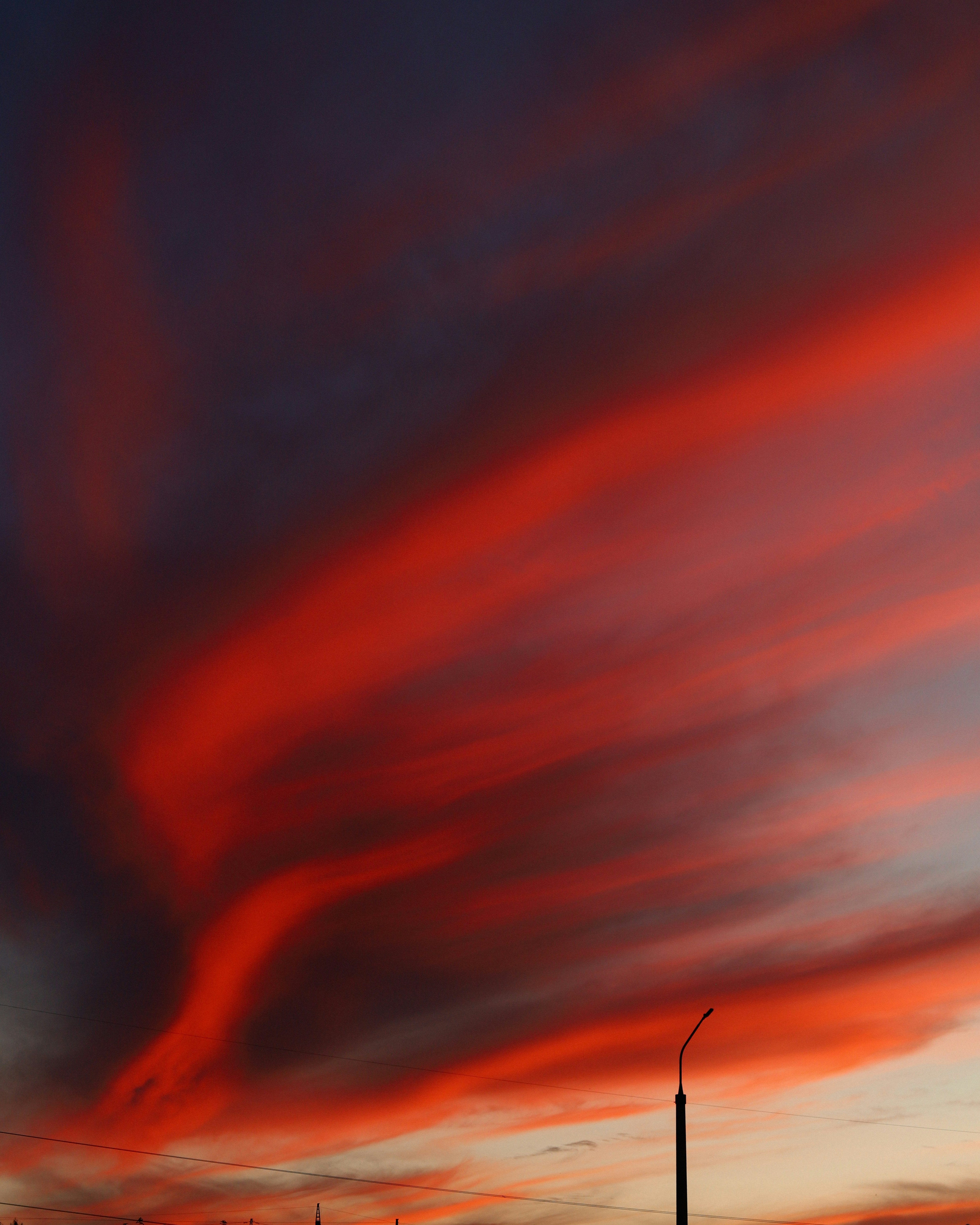Scarlet Nebula over the Horizon: A Dusk Sky Unfurls