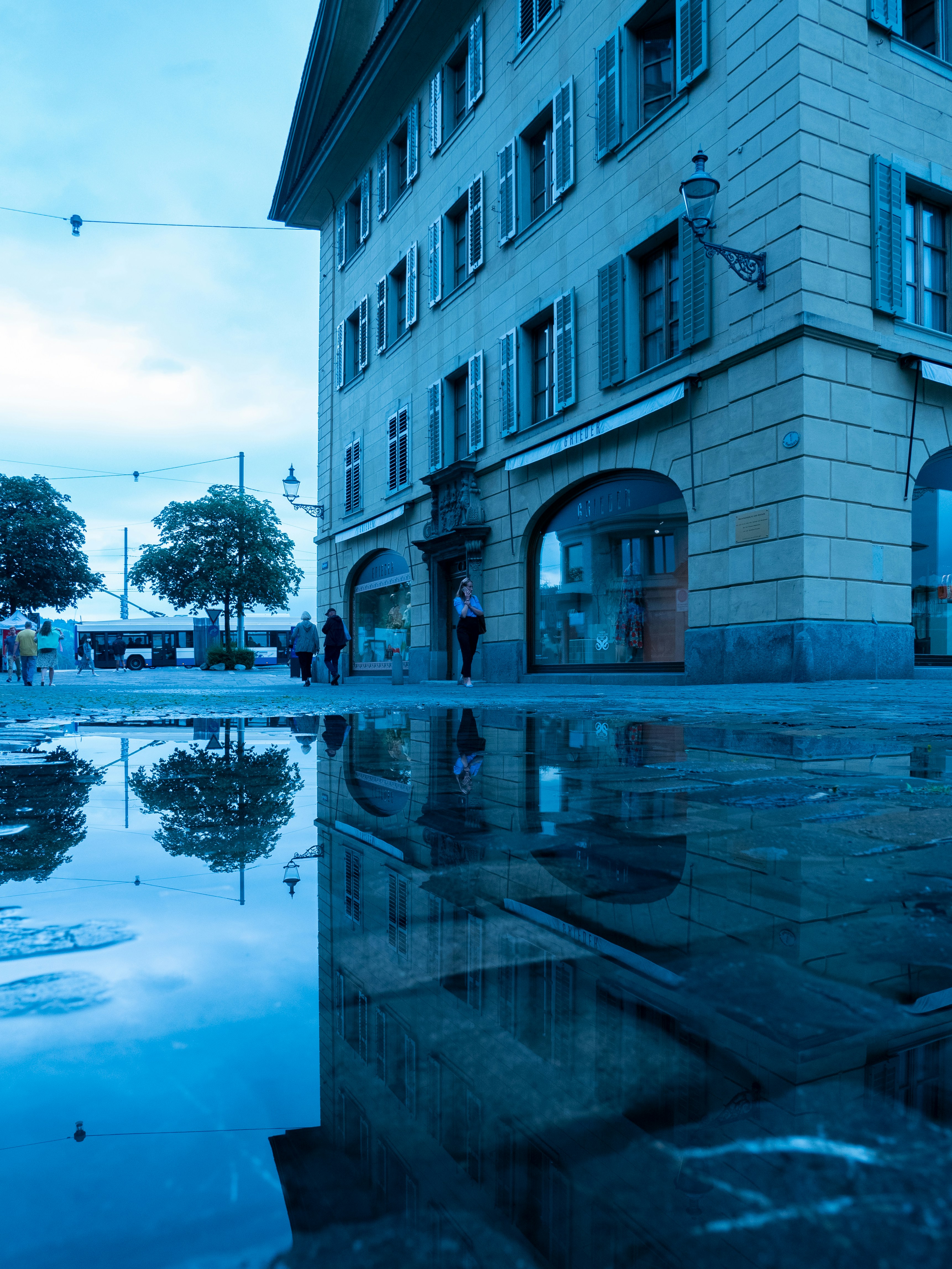 Blue Hour Echoes Along an Arcaded Facade
