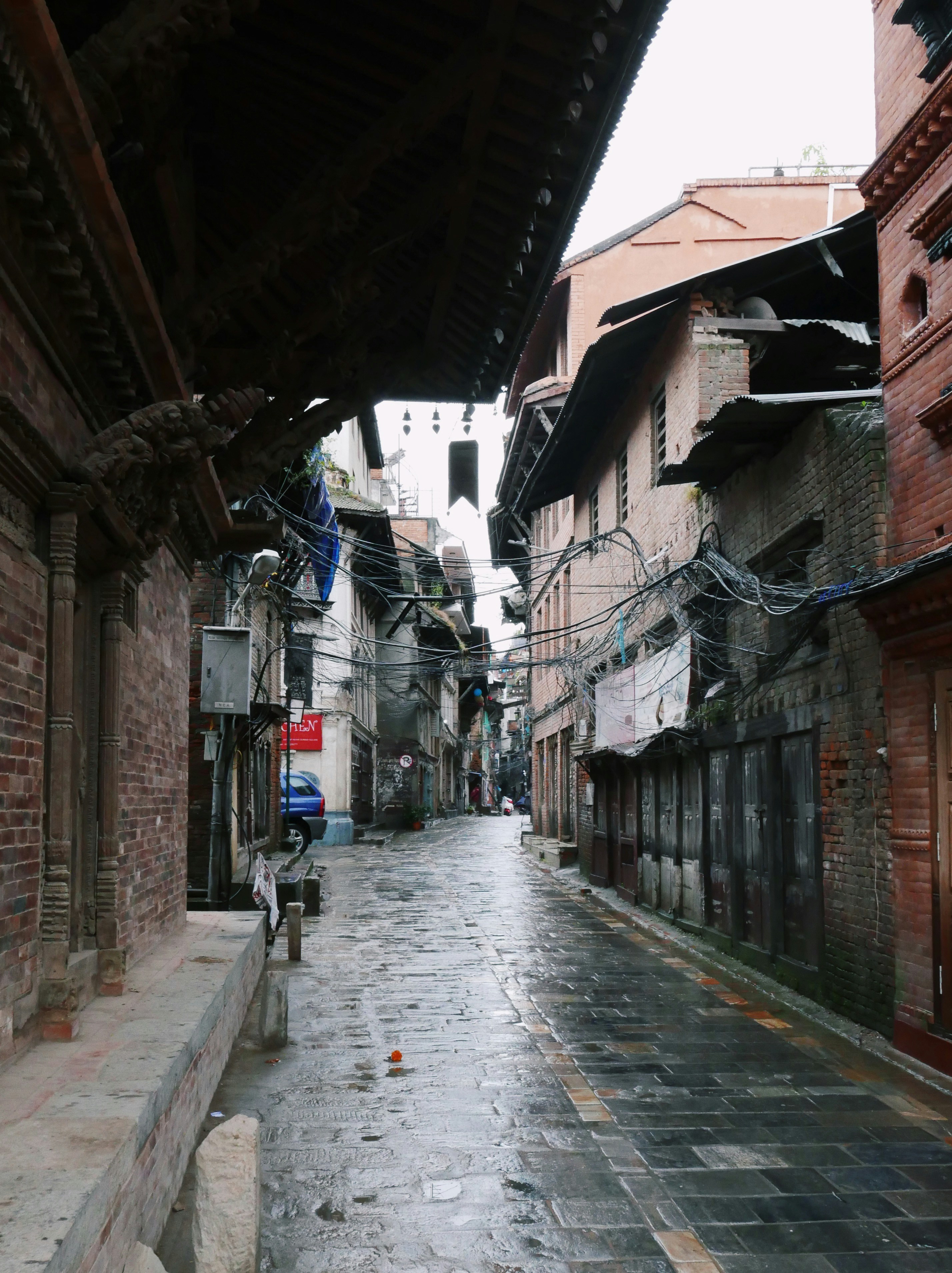 Narrow Mountain Street in Rain-Kissed Old Town