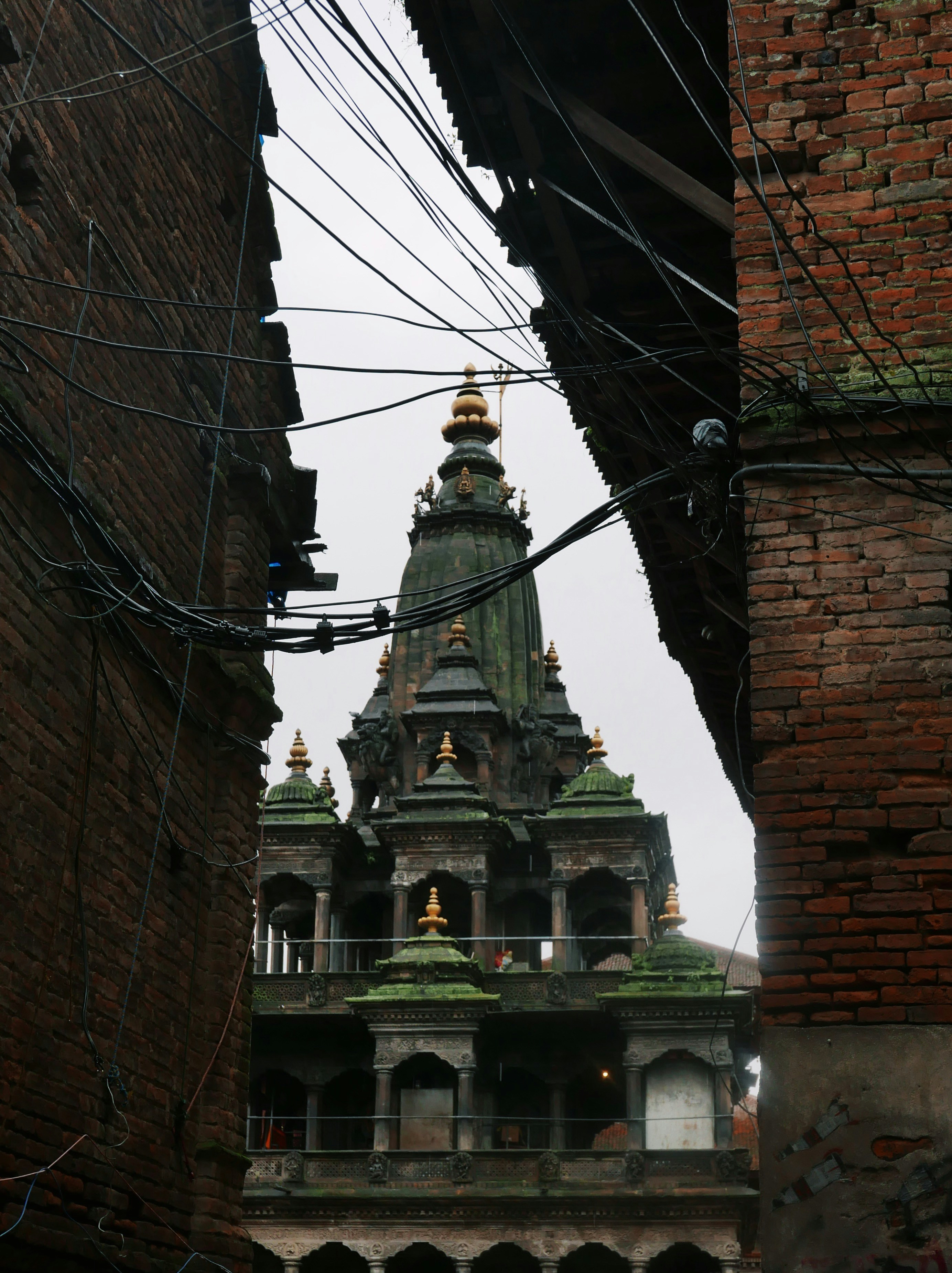 Emerald Spires Through the Narrow Brick Gorge