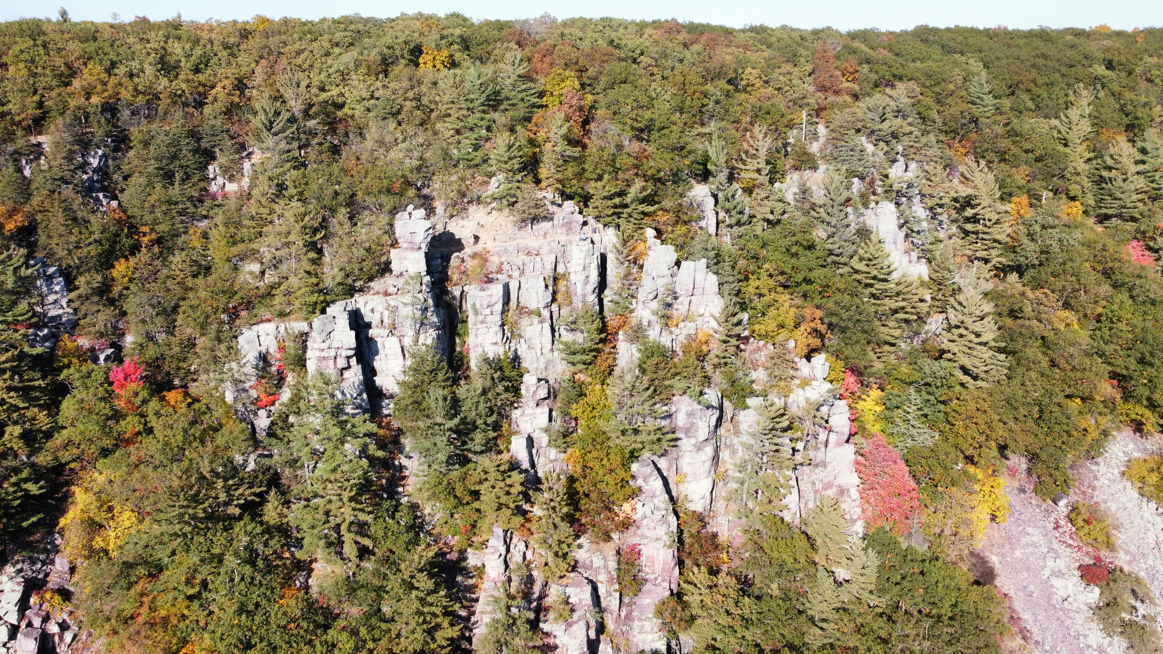 A rocky cliff with trees on it photo – Free Nature Image on Unsplash