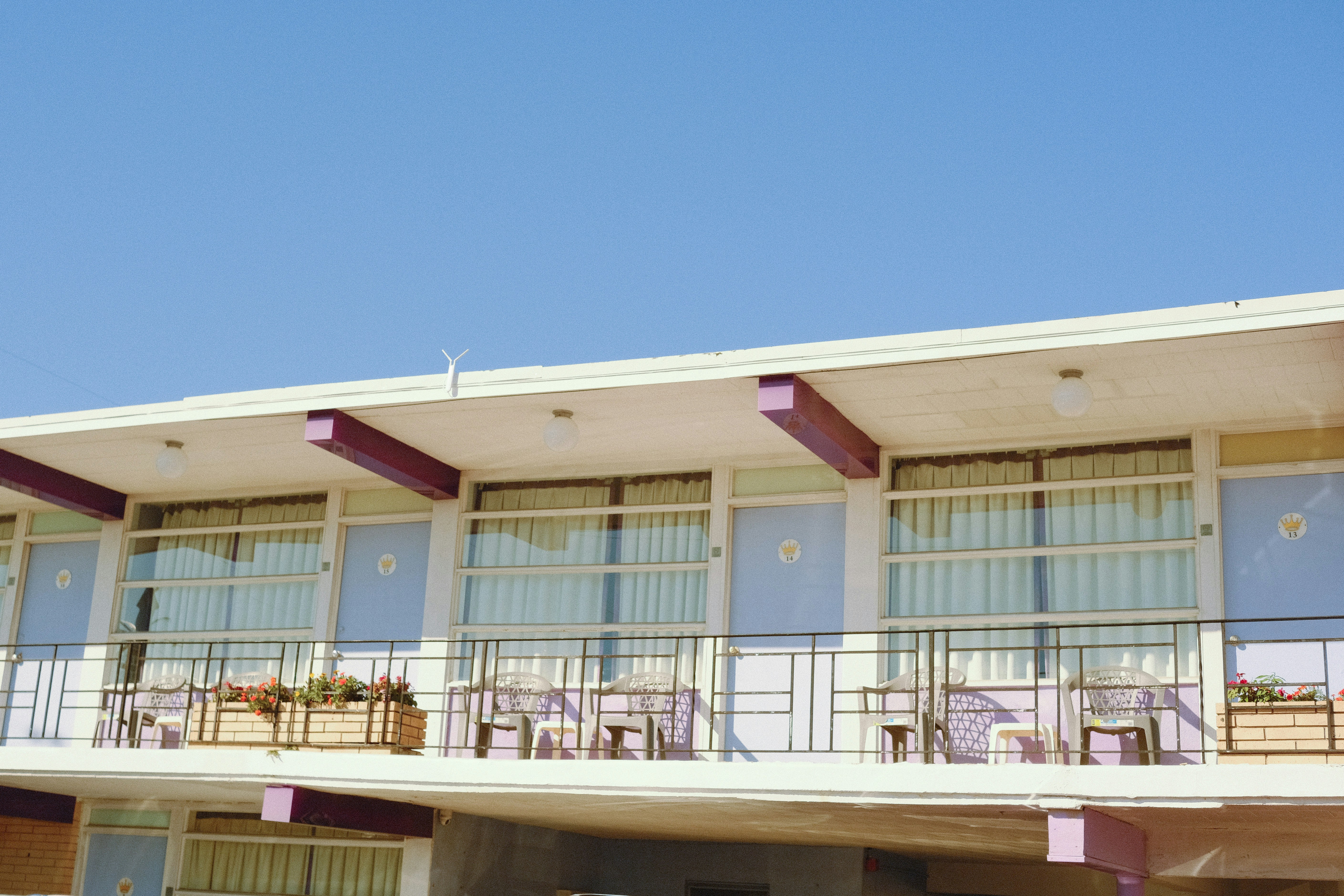 a building with a deck and chairs