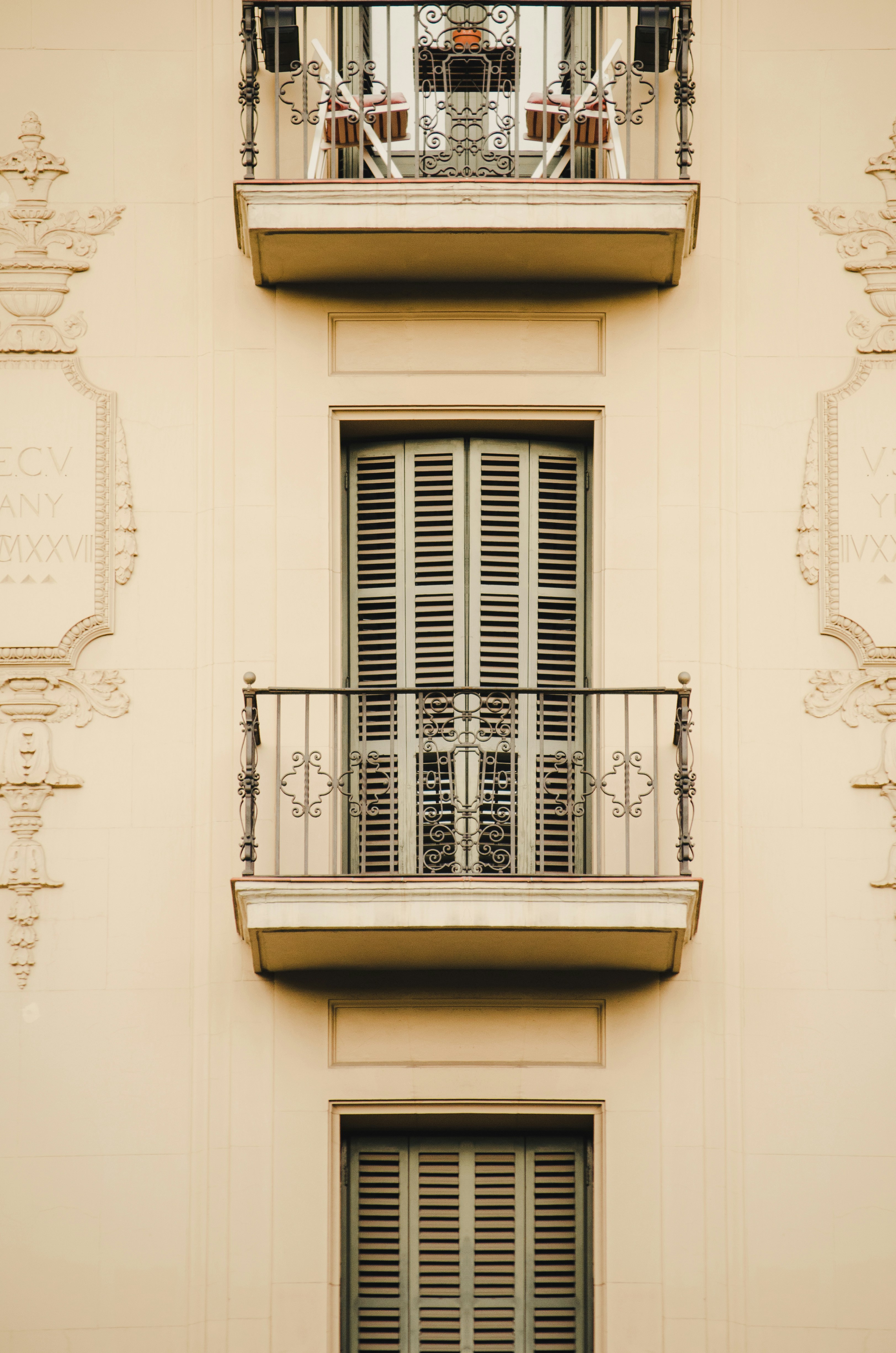 A window with a railing and a balcony with a railing photo – Free ...