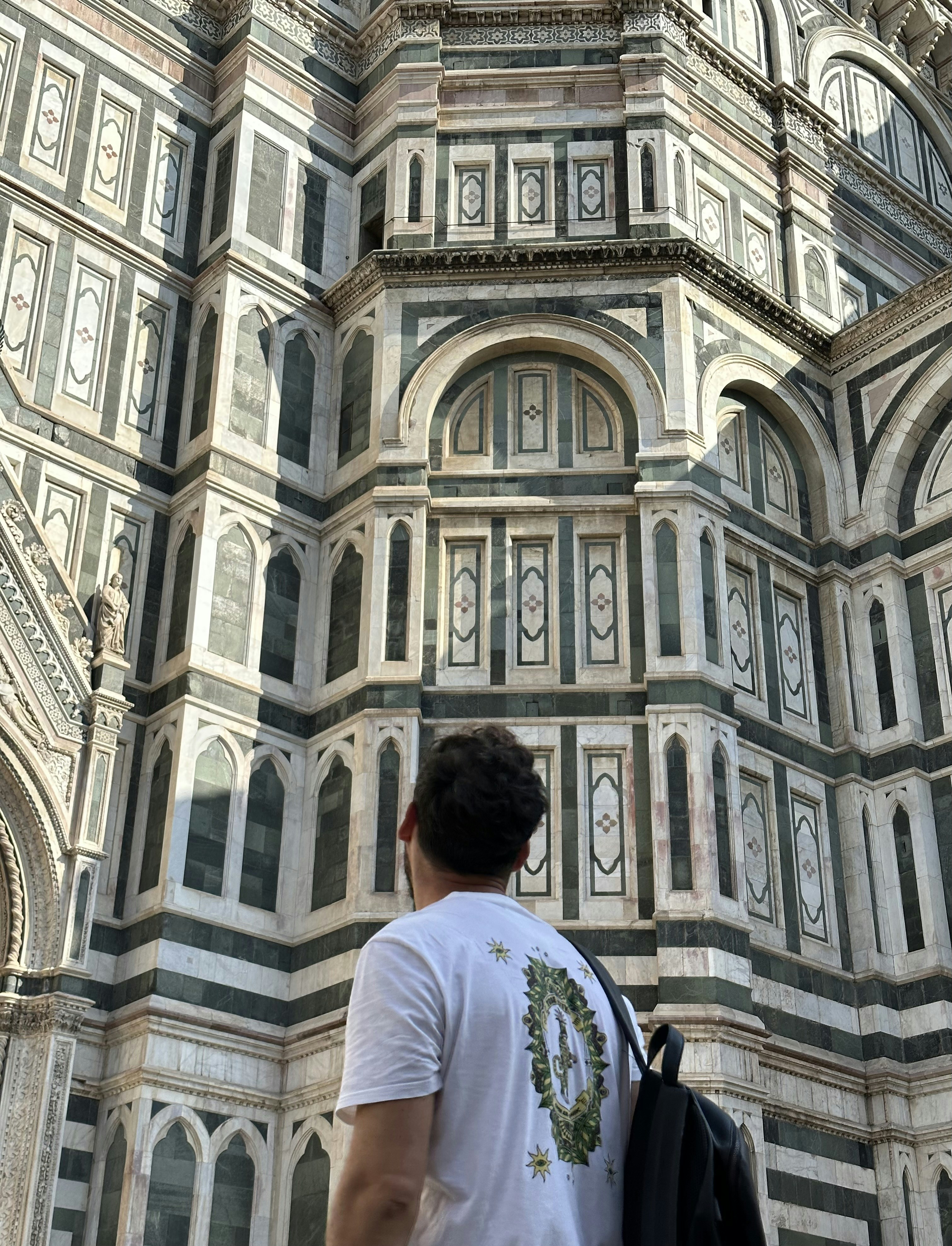 A man looking at a building photo – Free Image on Unsplash