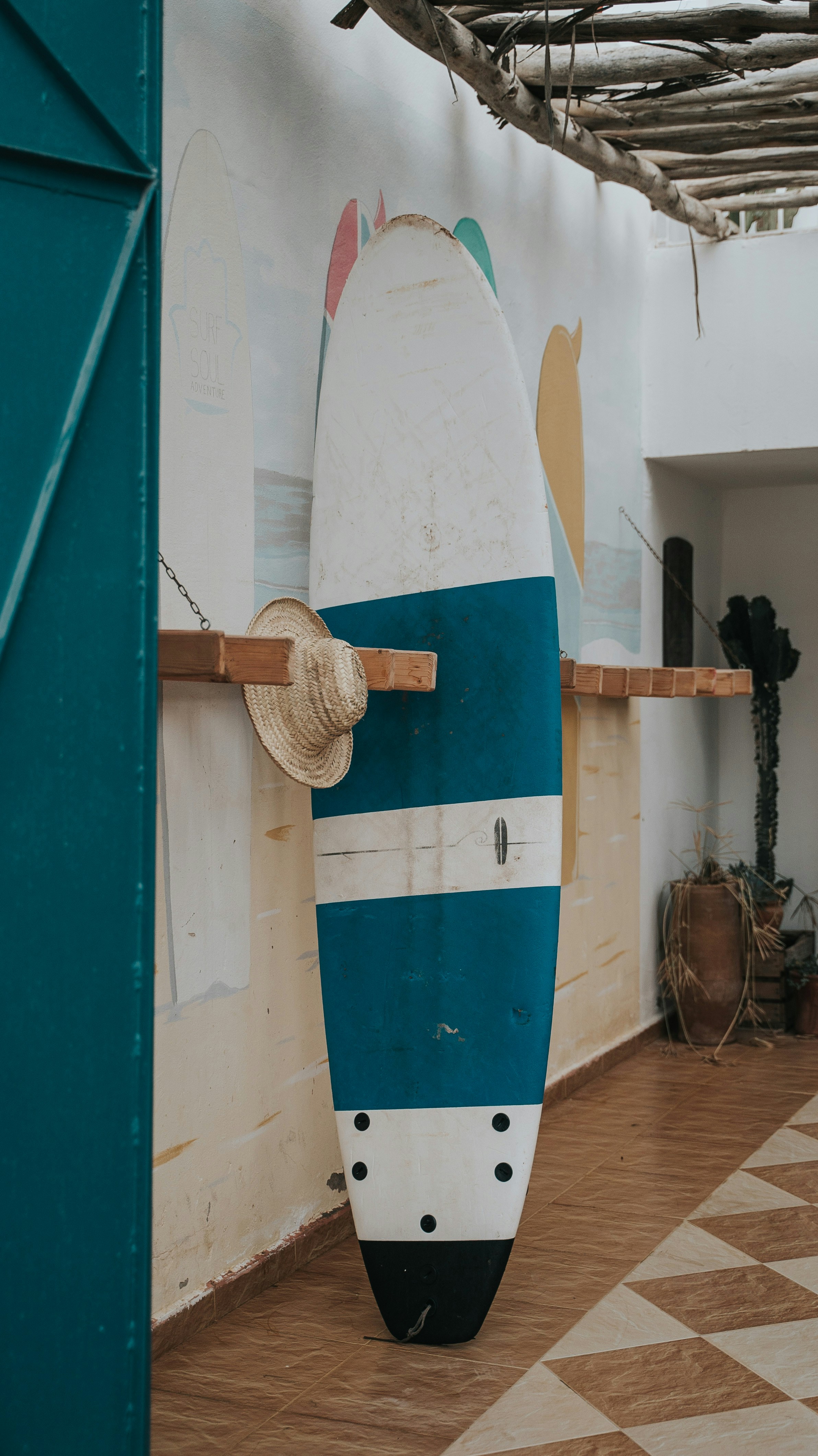a surfboard leaning against a wall