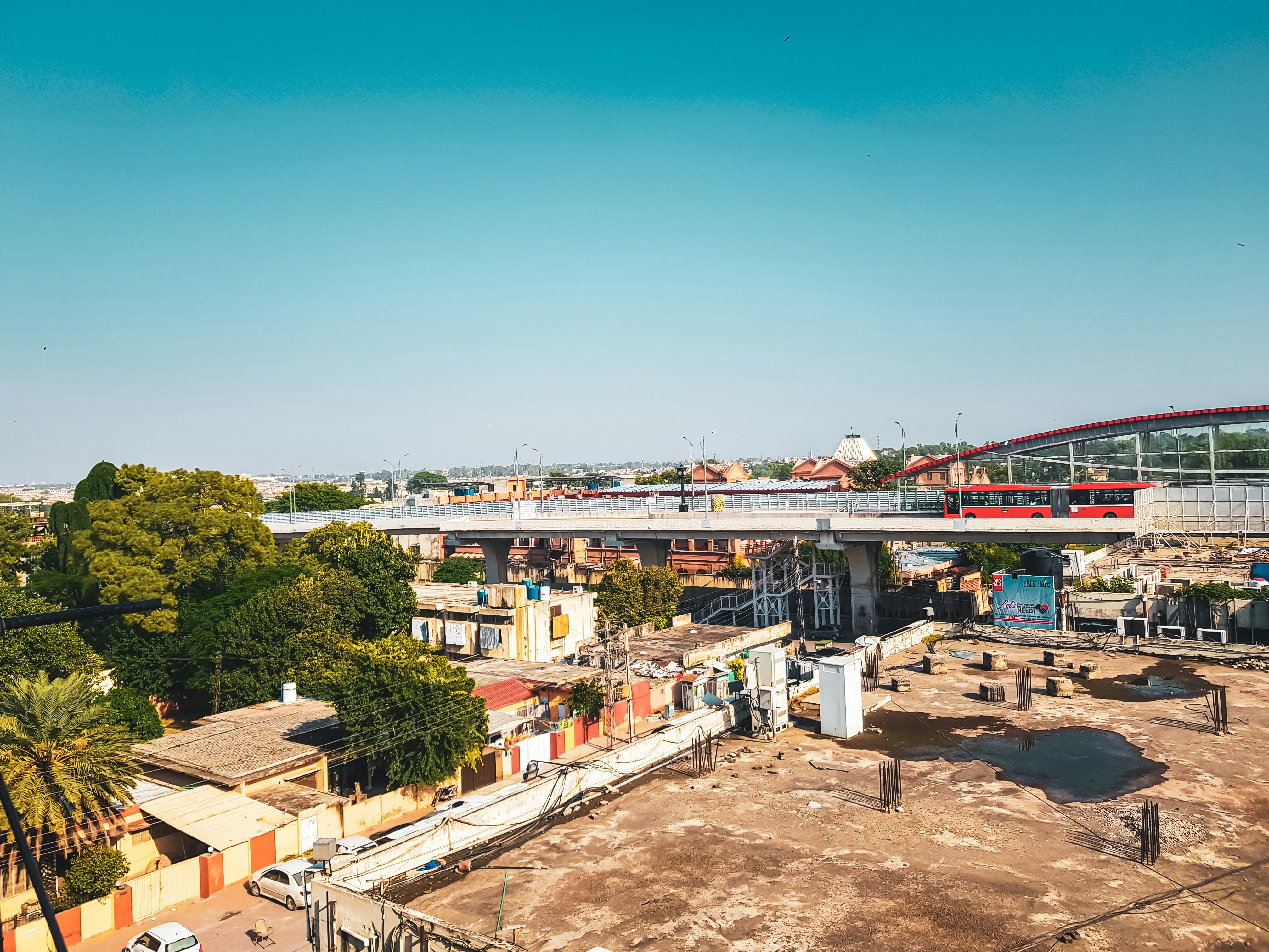 Urban Train Glide Across Elevated Path