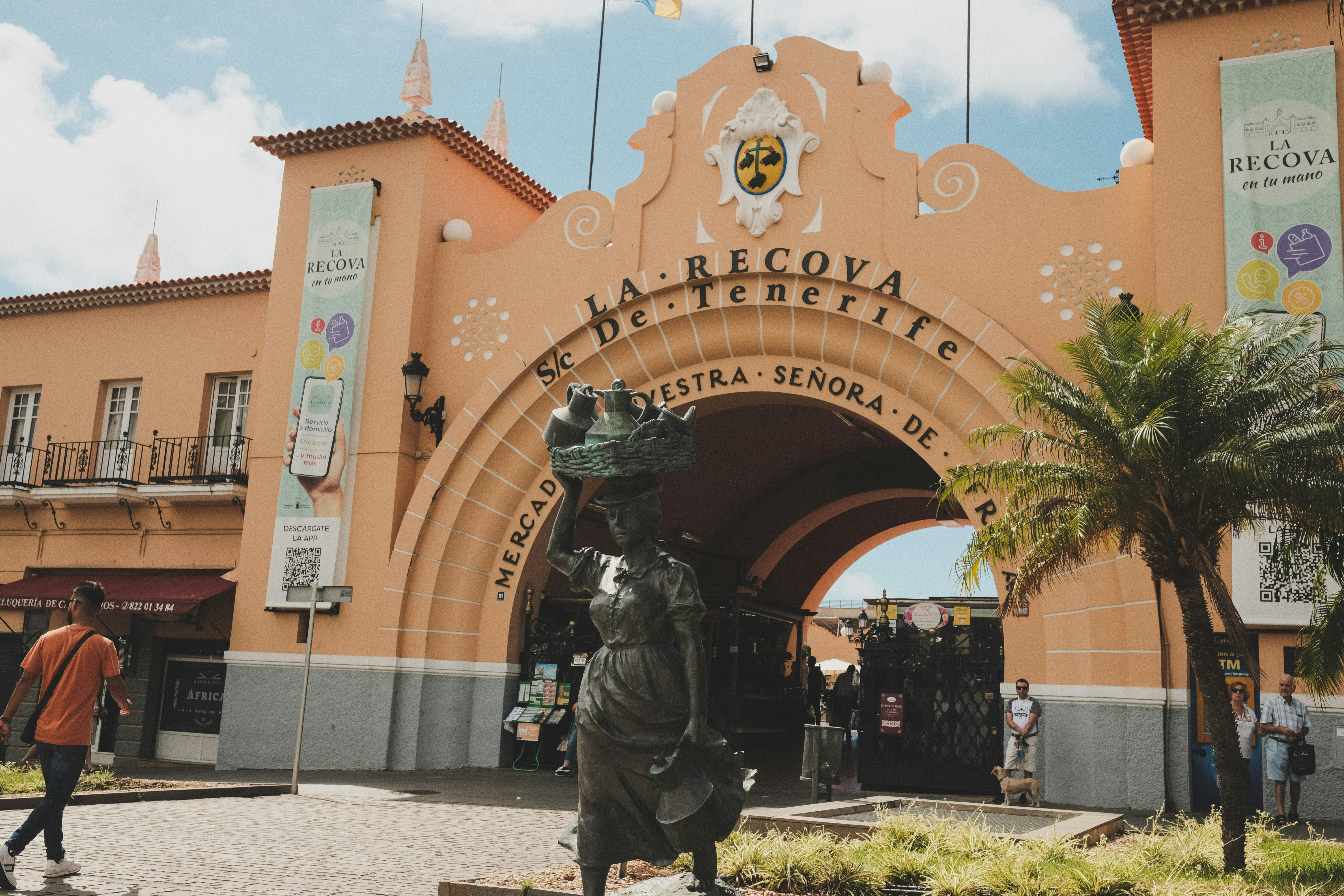 a statue of a man in front of a building
