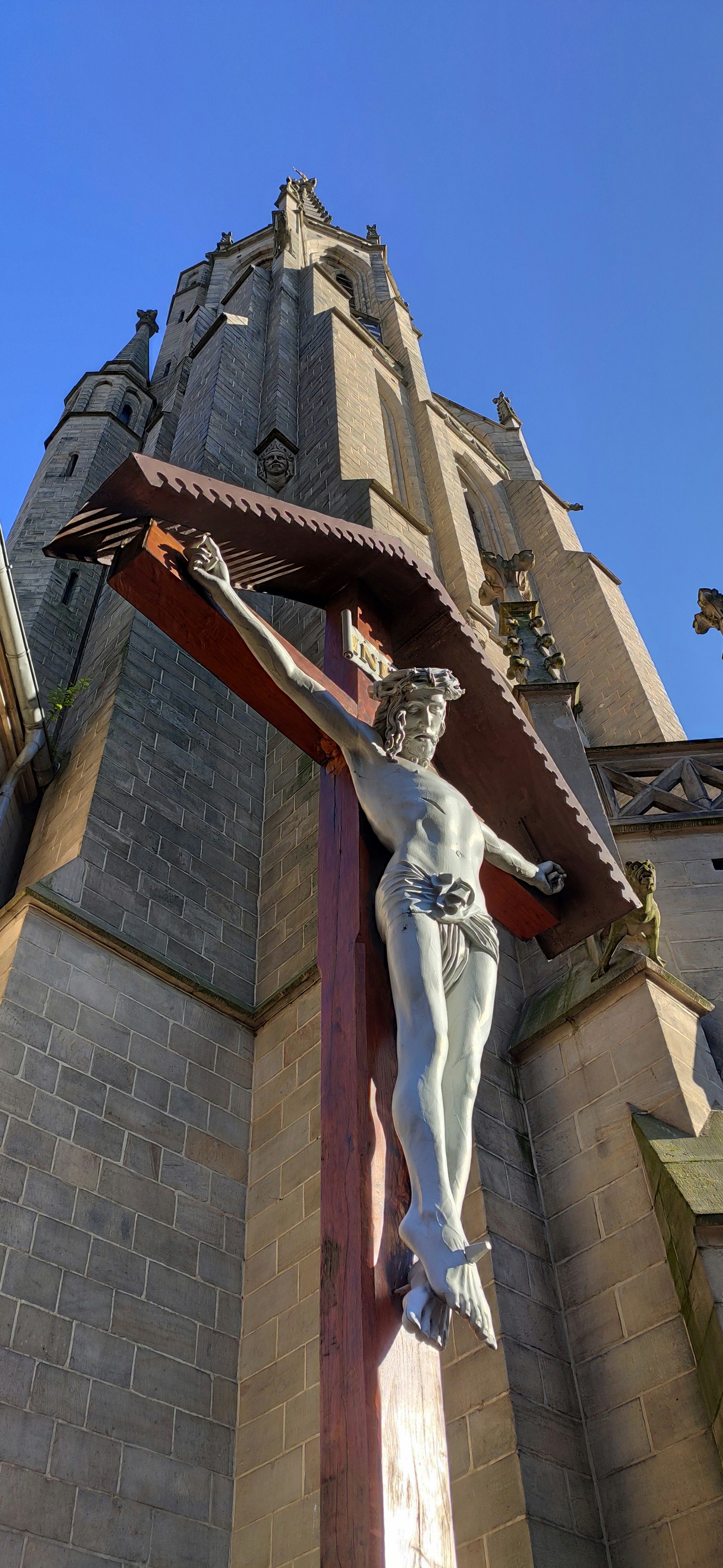 a statue of a person holding a torch in front of a building