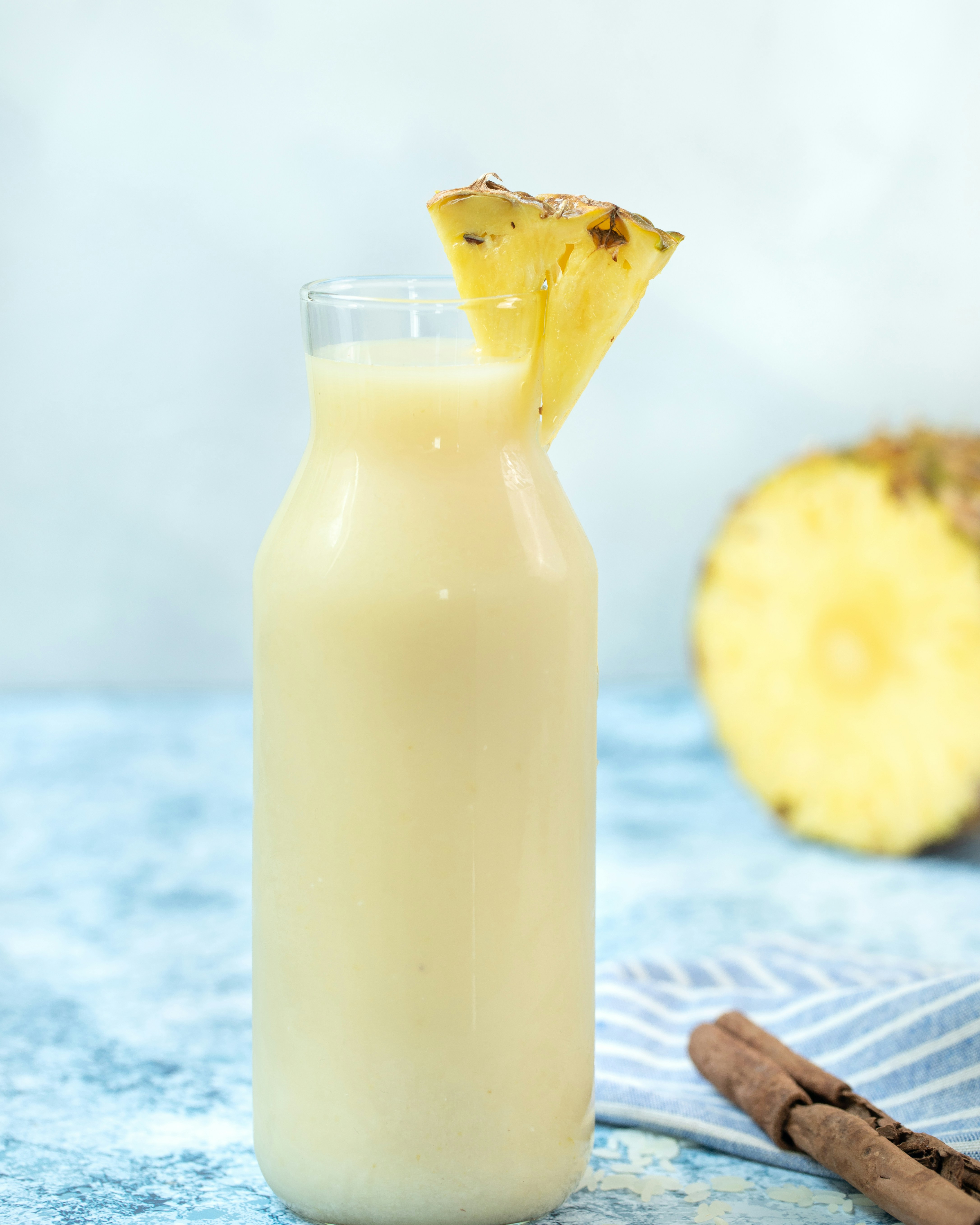 A glass of milk with a lemon slice and a lemon slice photo – Free ...