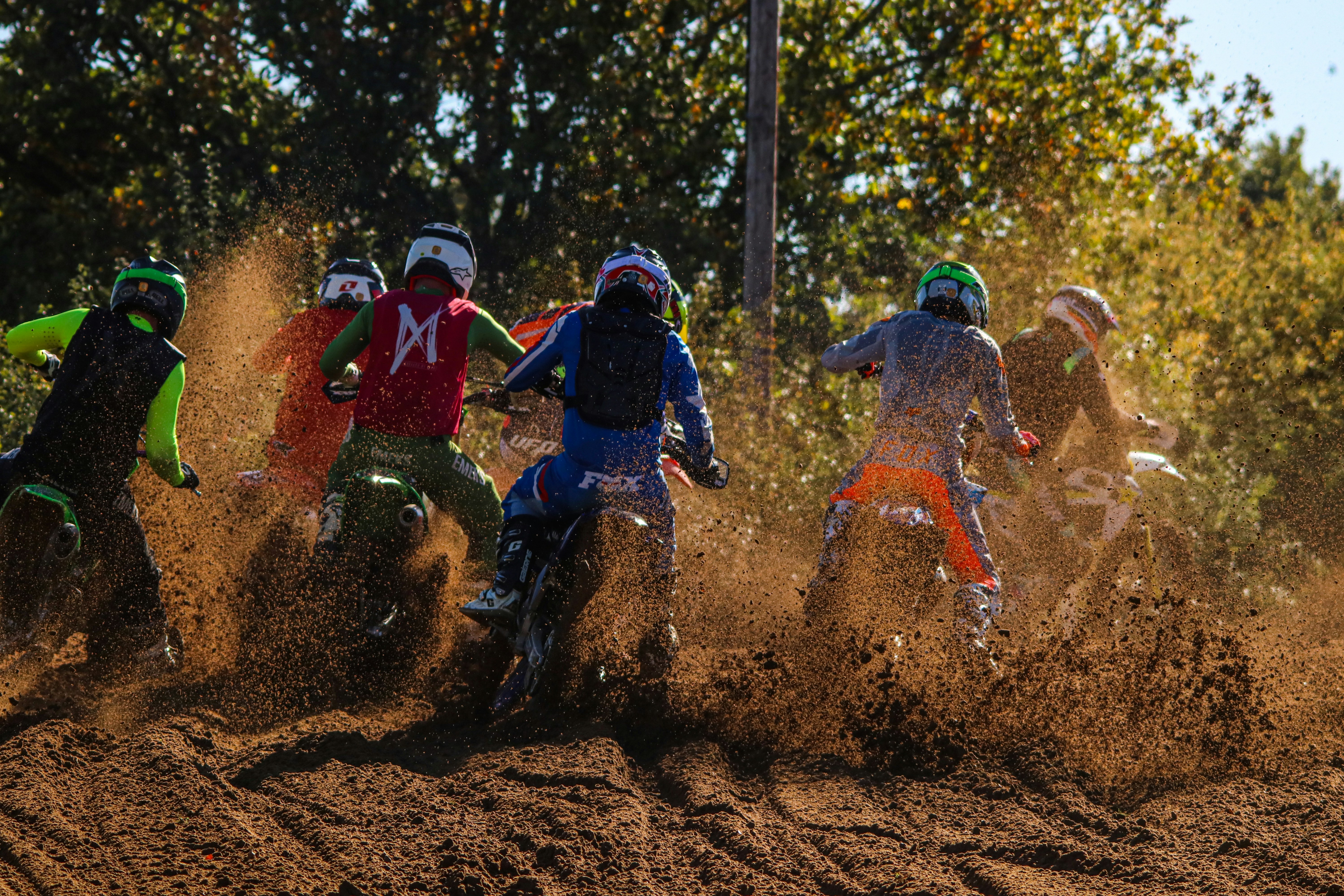 A group of people riding dirt bikes photo – Free Lyng Image on Unsplash
