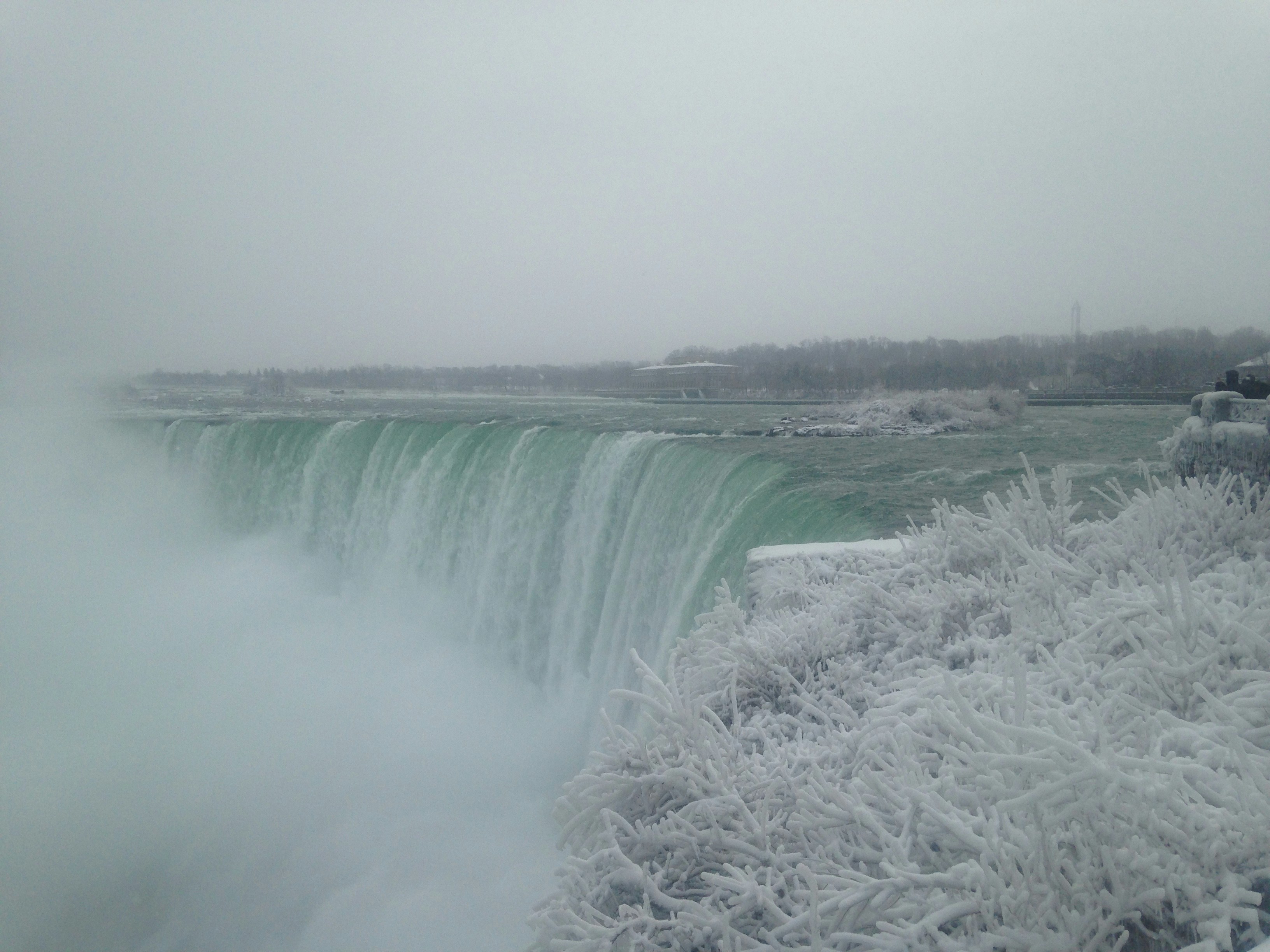 Niagra falls during frigid winter conditions creates a wold of ice. The strong mist from the falls freezes on every plant, hand rail, light pole, and rock in the vicinity creating a wonderful mystical world of ice!