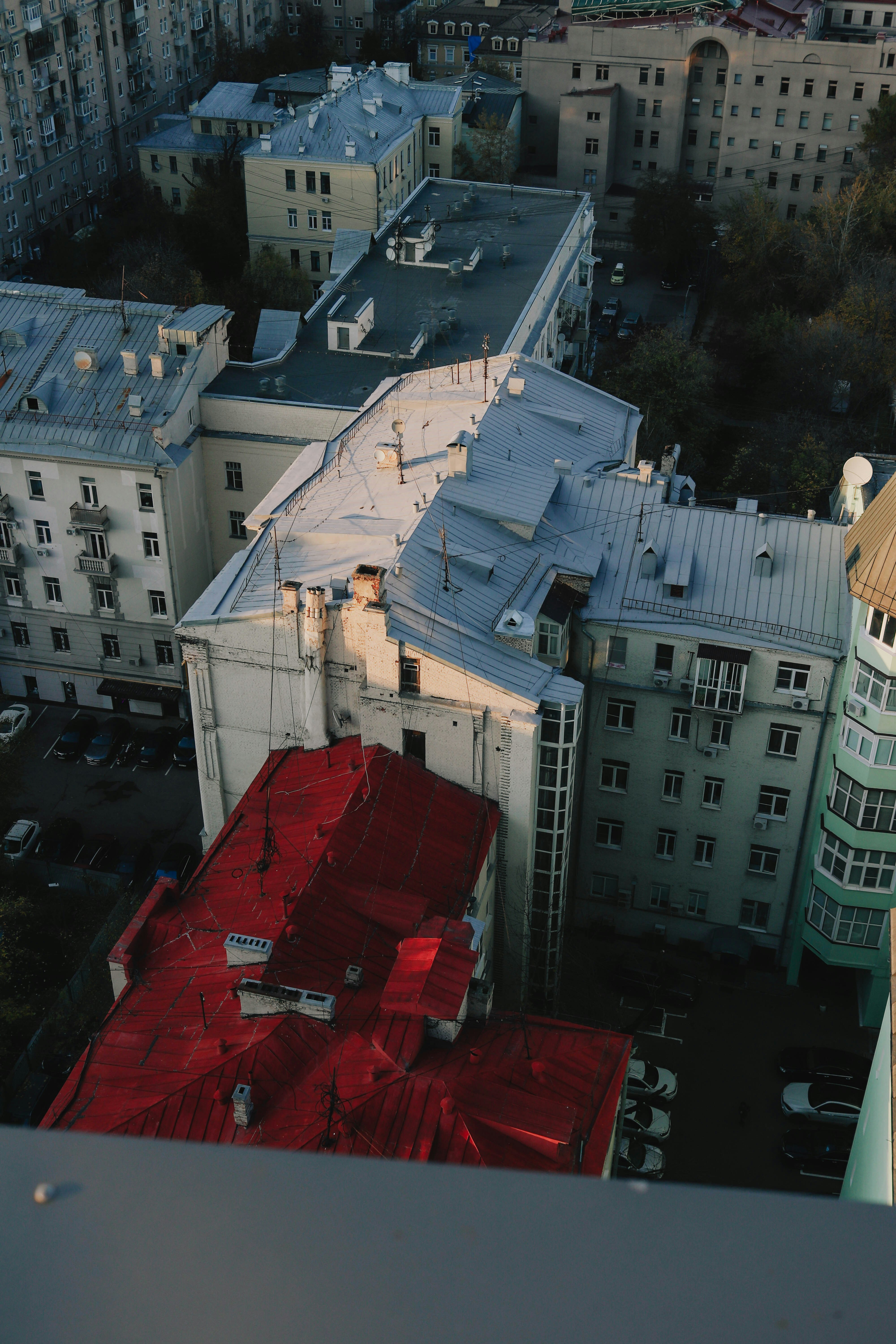 Crimson Roofscape Over a Quiet City Block