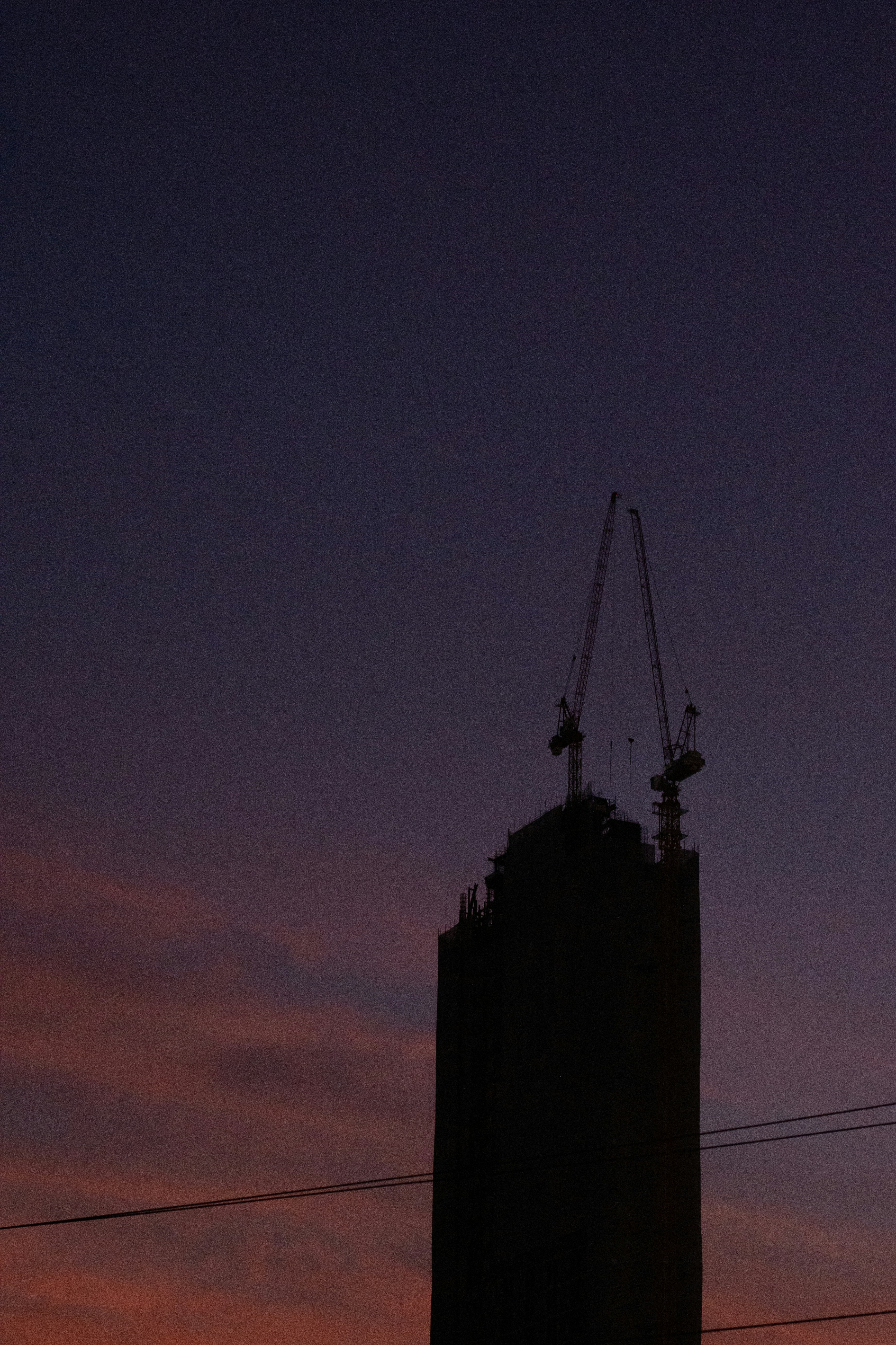 Twilight Skeleton over the City: Crane Tower at Dusk