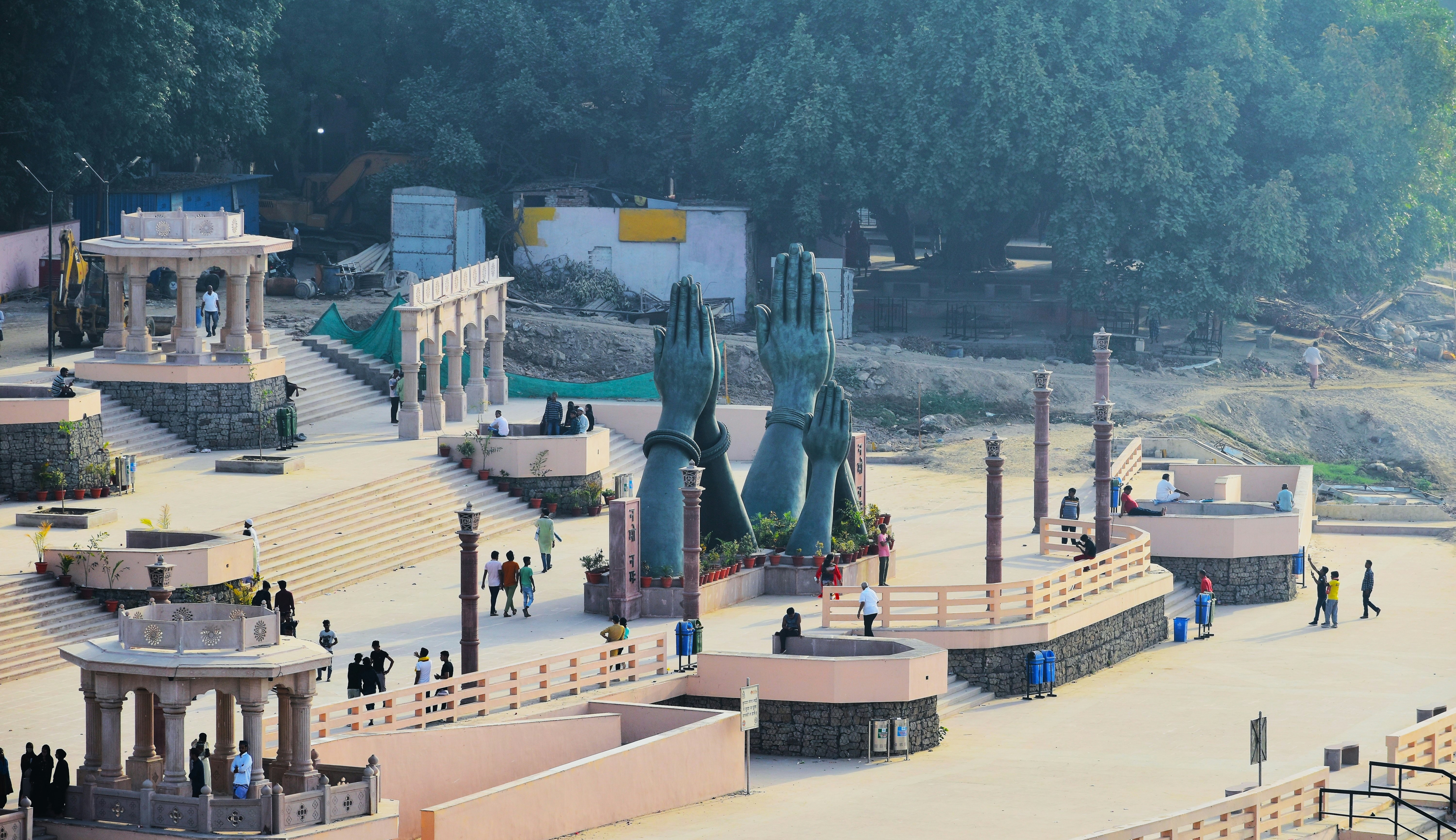 A large statue in a courtyard photo – Free Namo ghat varanasi Image on ...