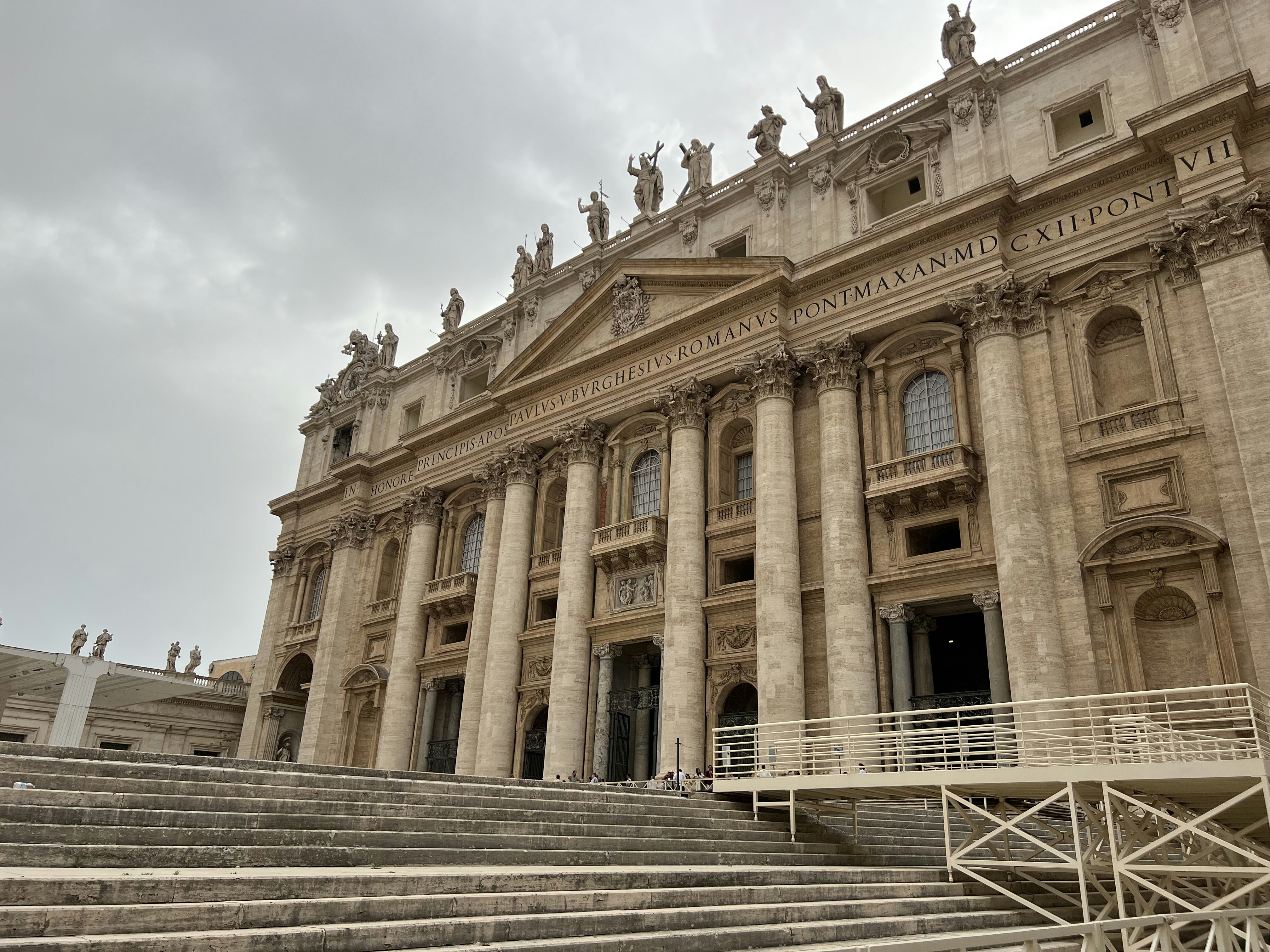 Stone Majesty on the Steps: Facade of a Grand Cathedral