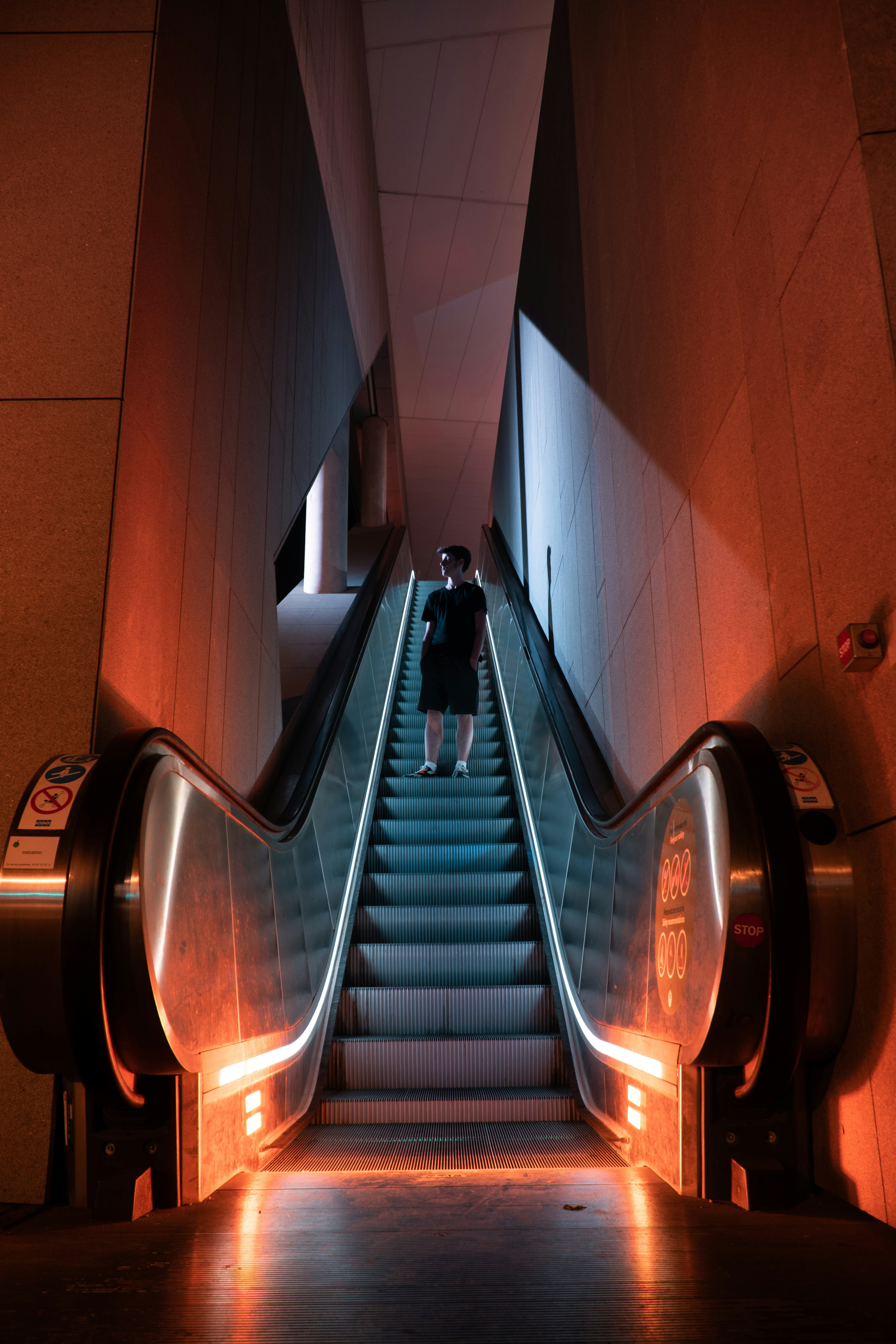 A person walking down a flight of stairs photo – Free La défense Image ...